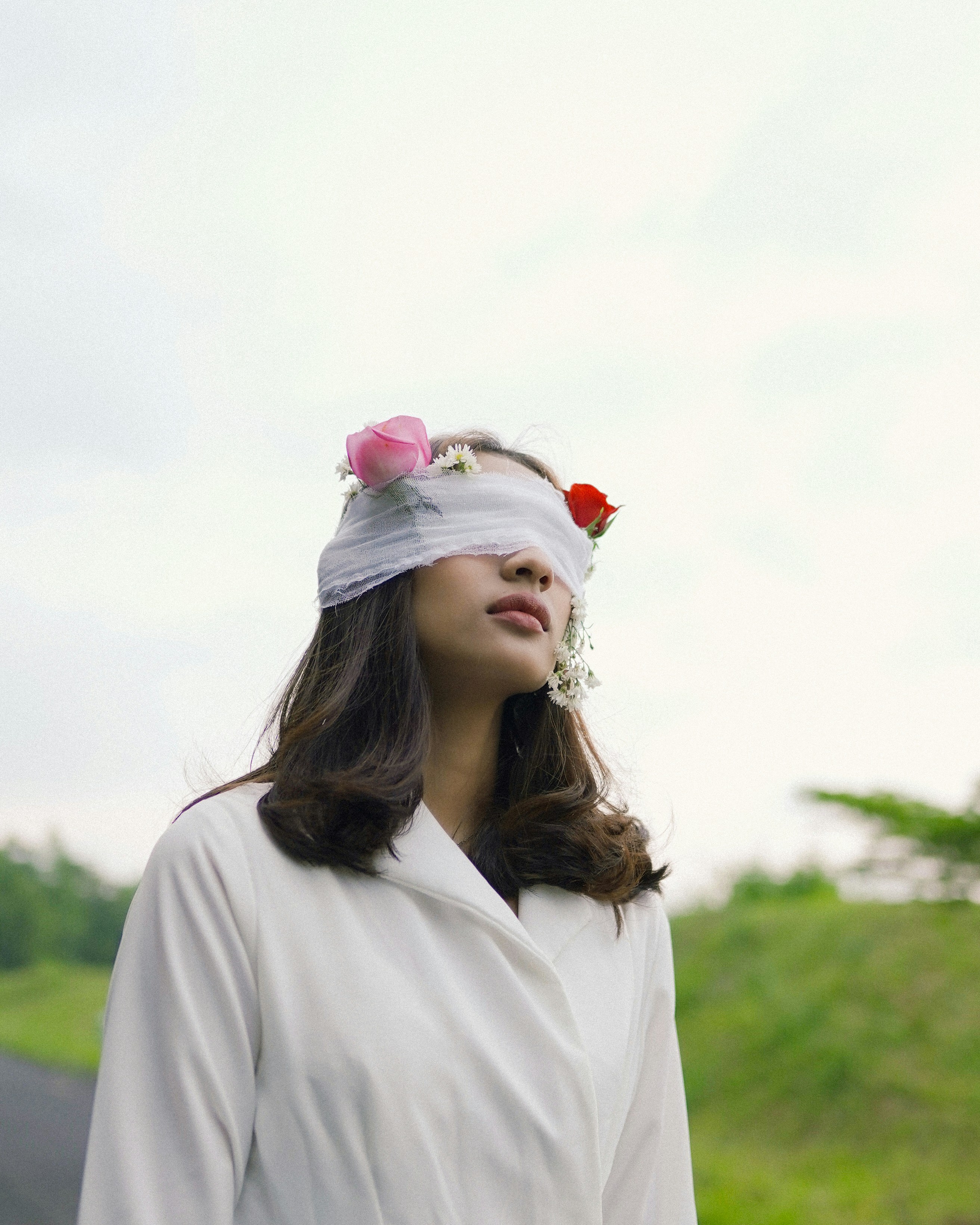 Veiled by Petals: A Quiet Portrait in a Sunlit Field
