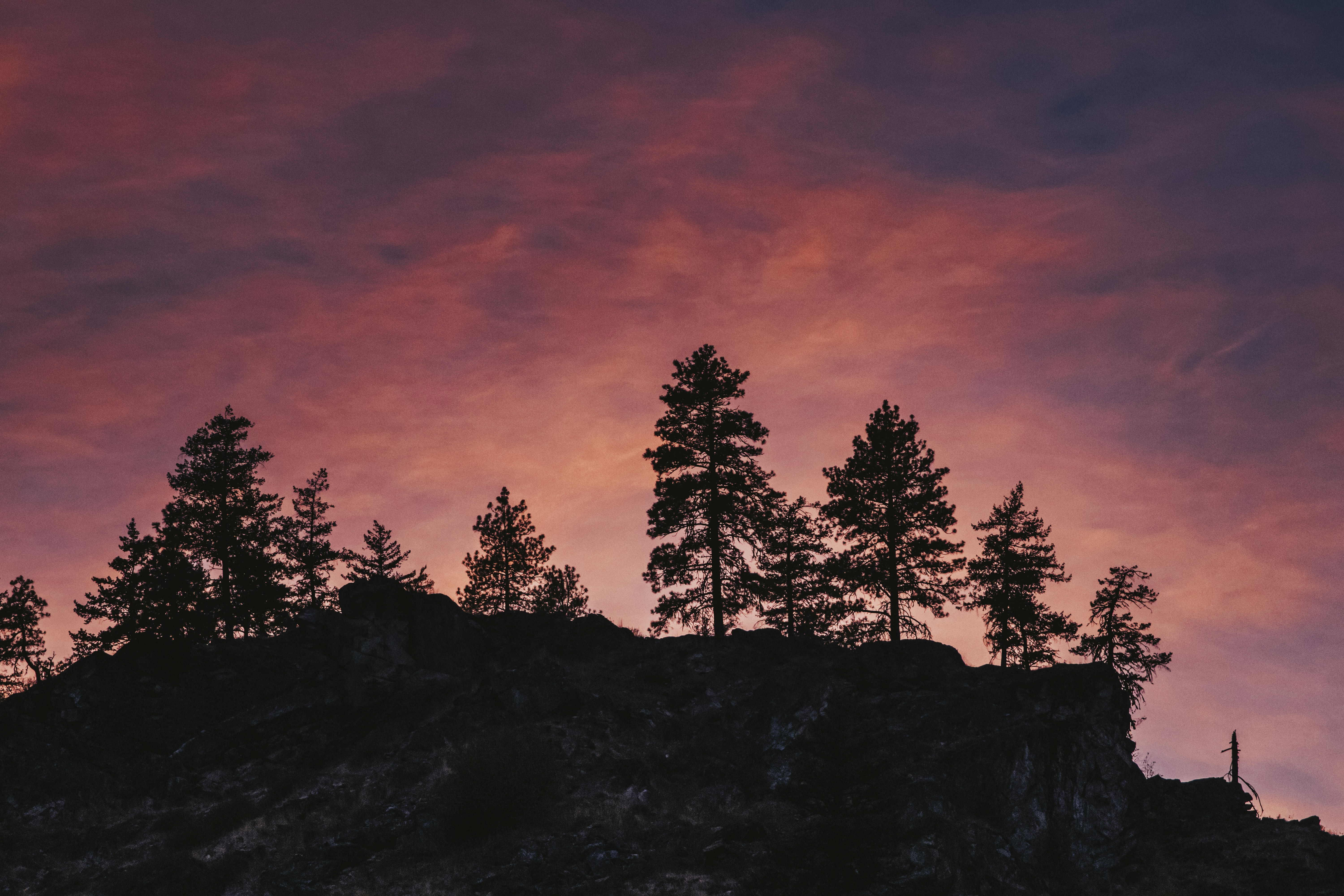 Crimson Crest: Sunset Silhouette on a Rocky Ridge
