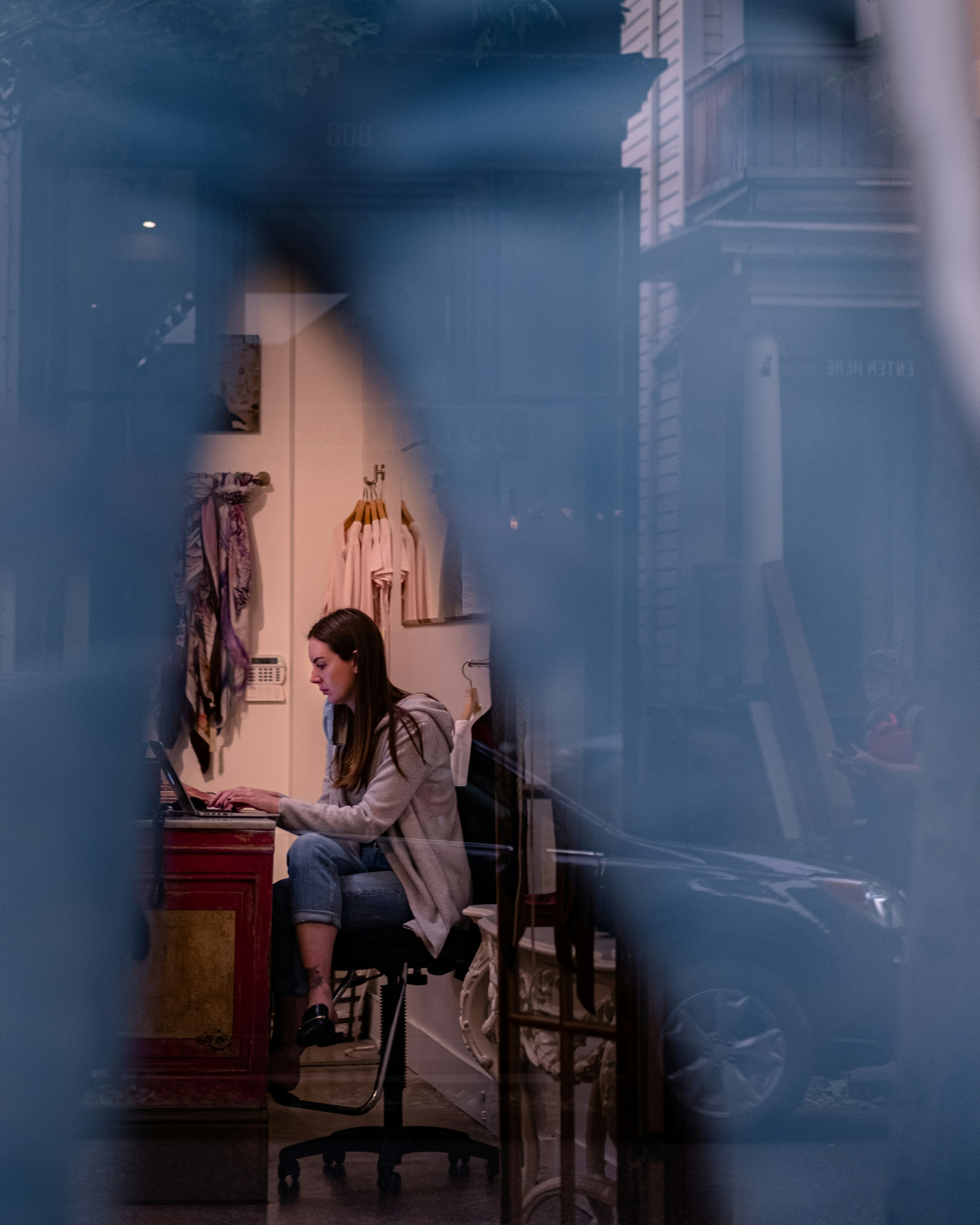 Through a Shaded Window: A Focused Studio Moment in a City Wardrobe