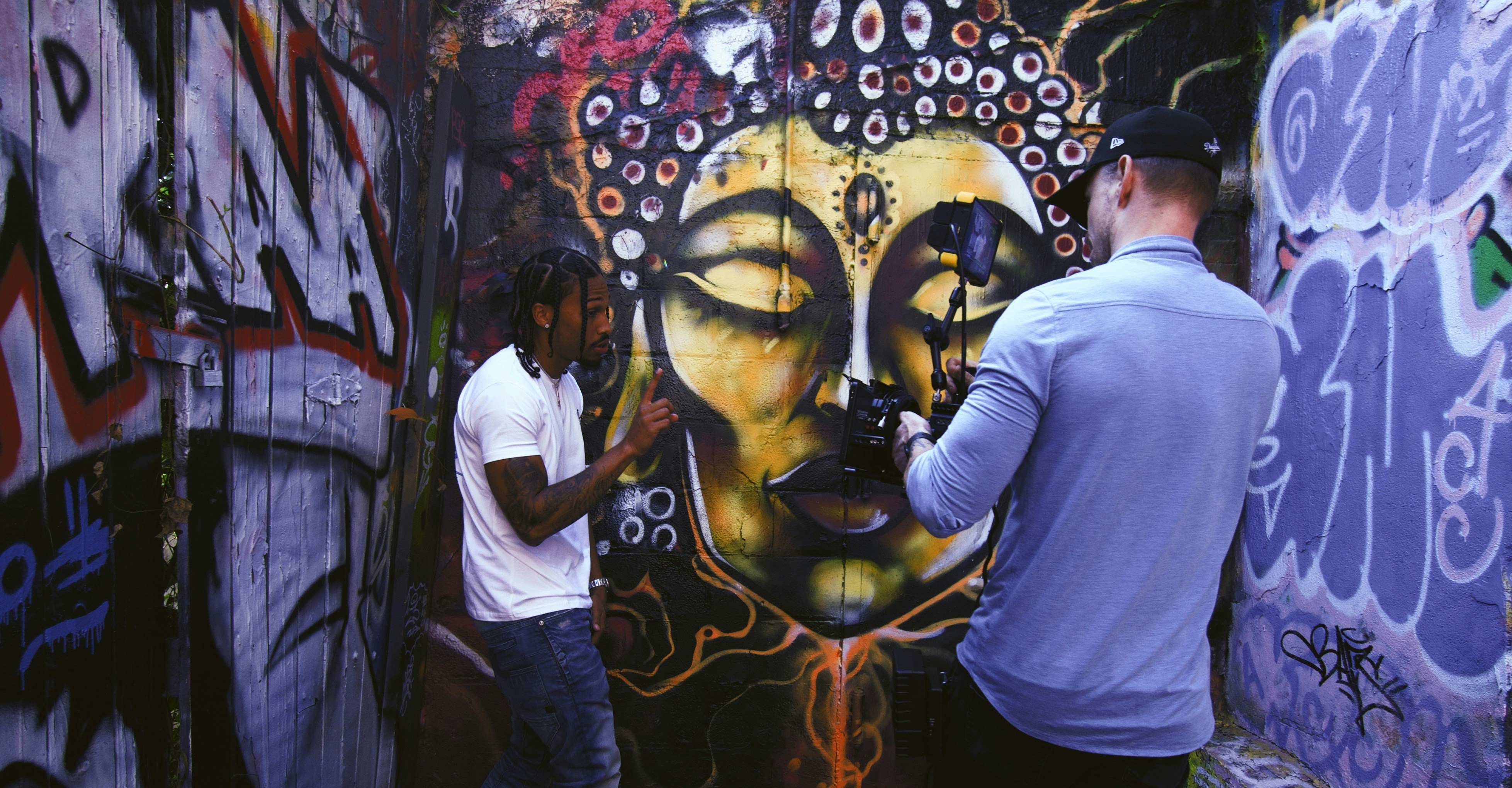 Graffiti Session Before a Golden Buddha