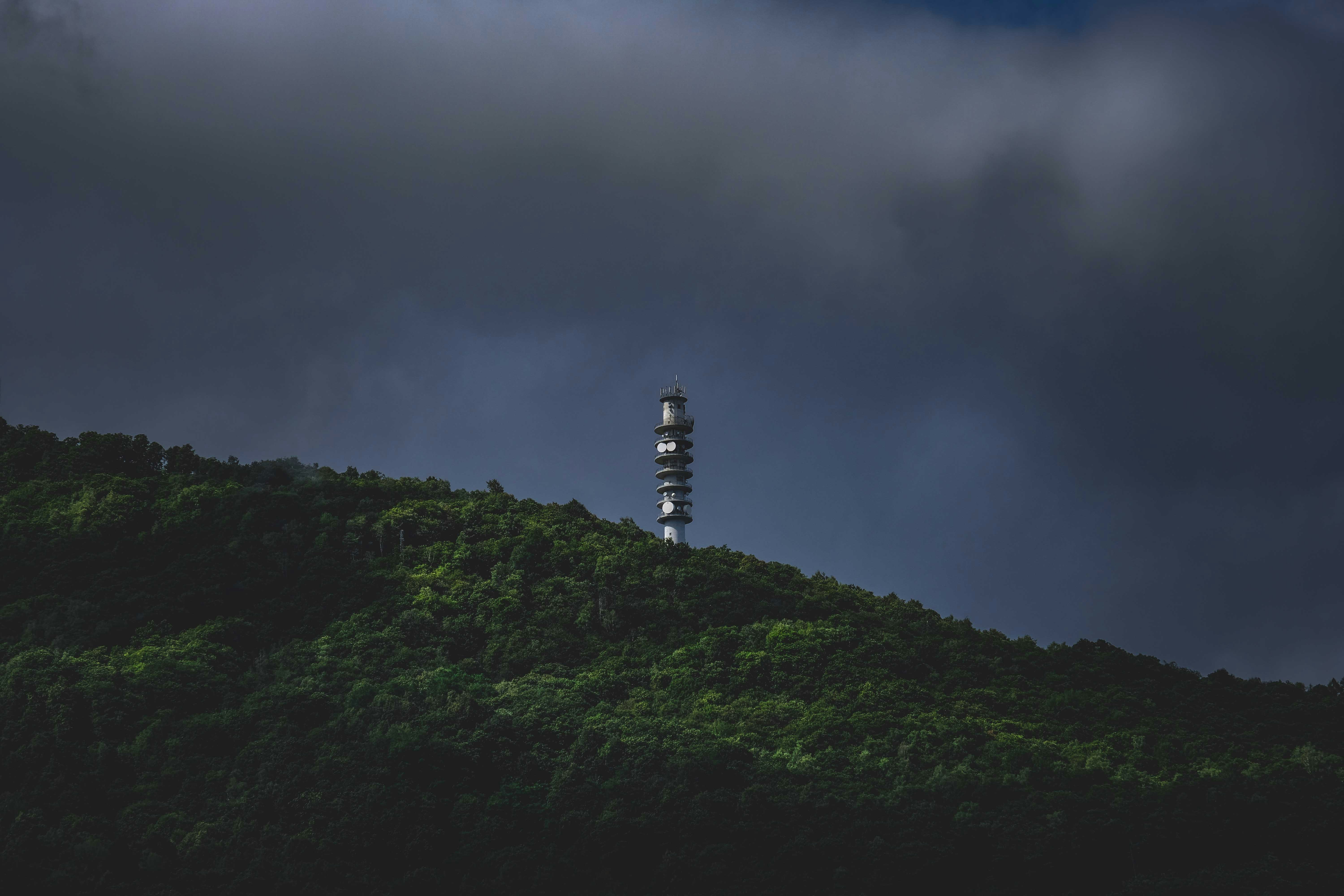 Ridgecrest Signal: Lone Tower Standing Against Brooding Clouds