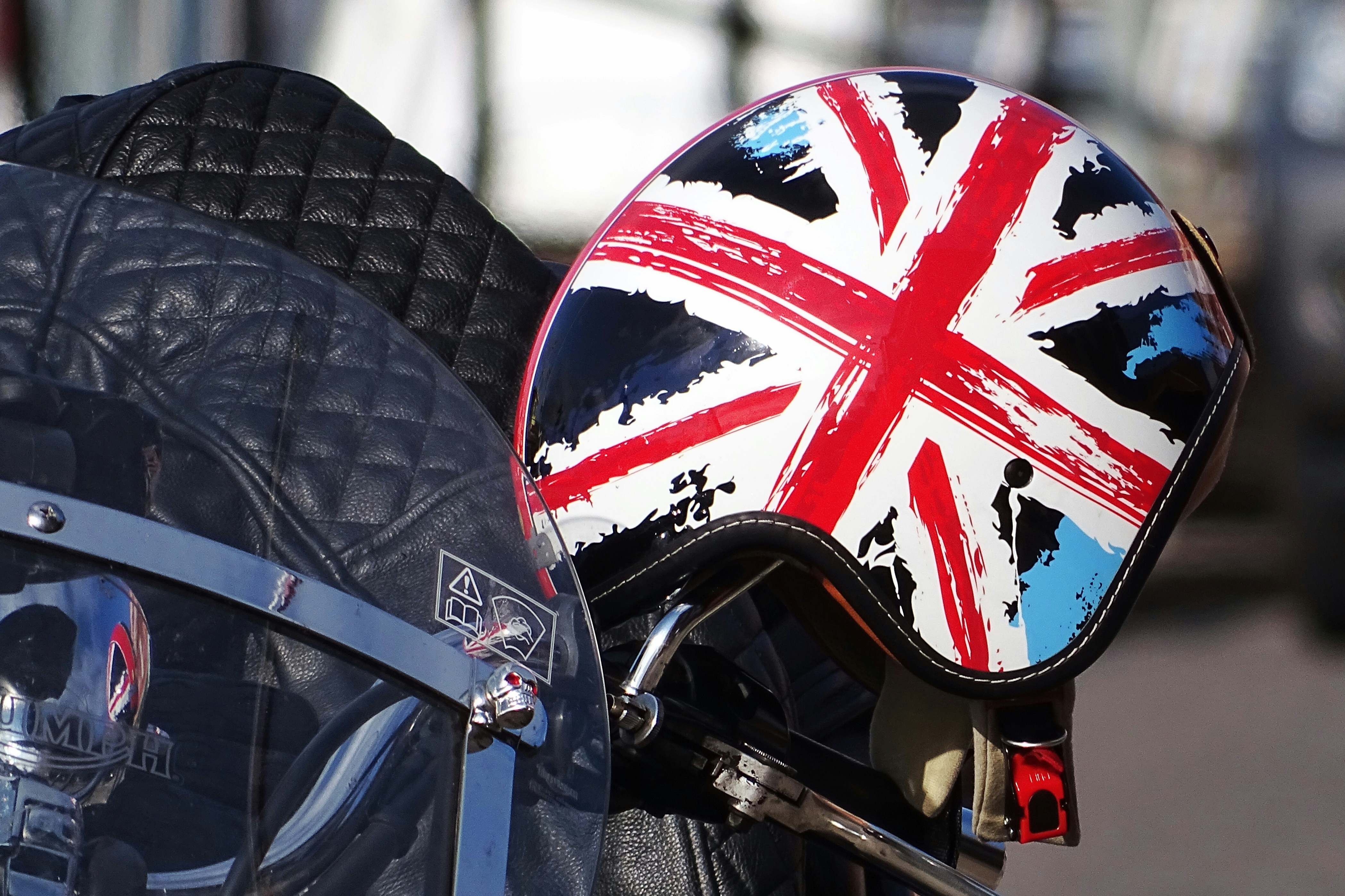 Union Jack Helmet Against Leather Shadow: A Quiet Ride's Colorful Beacon