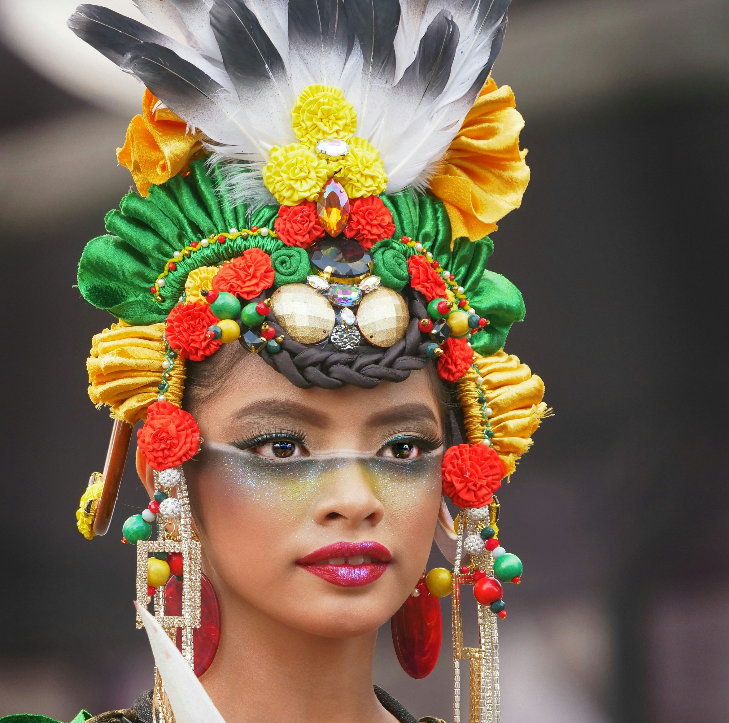 Vivid Carnival Headdress: Portrait of Color and Feather amid Jewelry