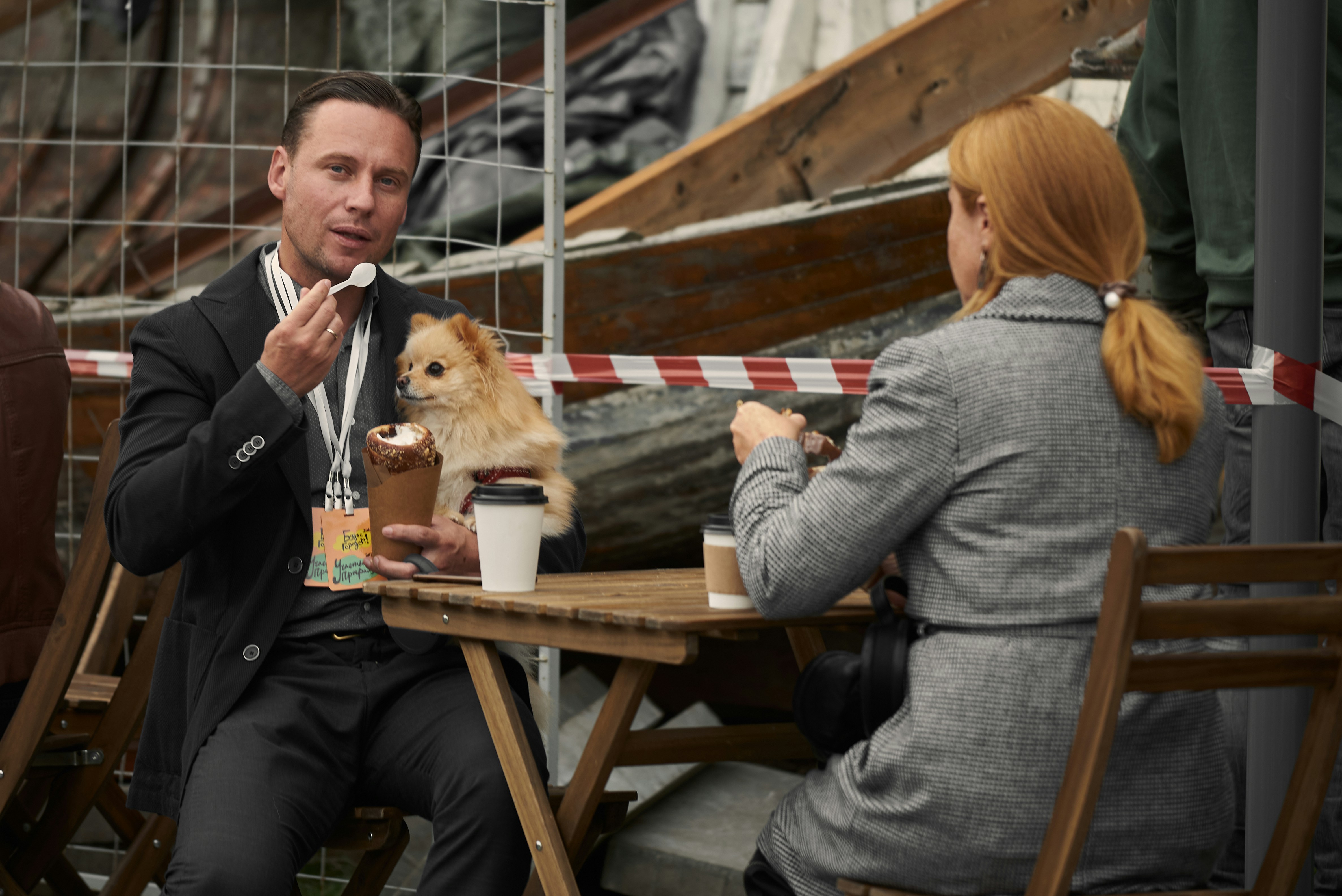 Dockside Café Moment: A Man, a Dog, and a Quiet Conversation by the Waterfront