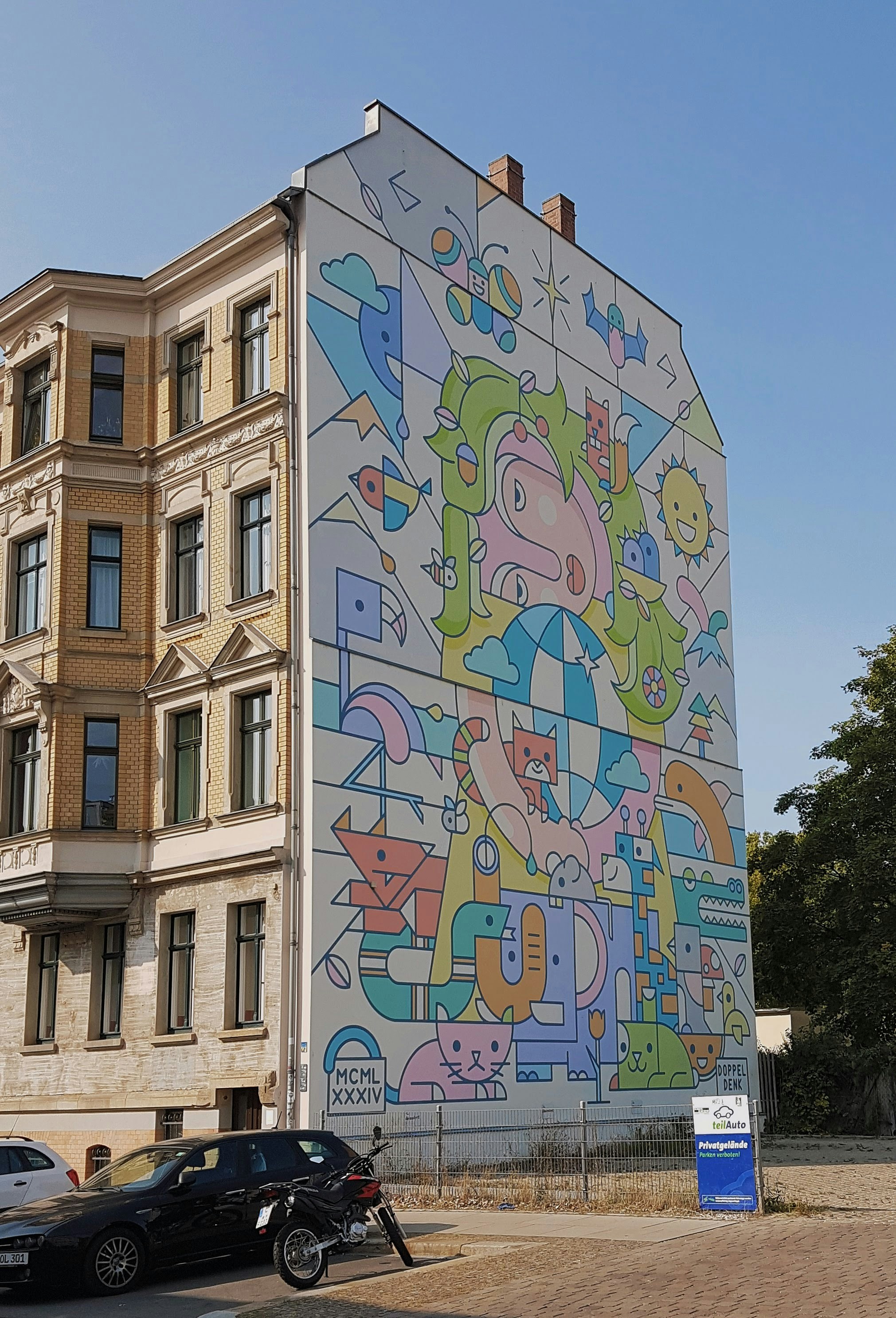 Mural Mammoth of Colorful Geometry Adorning an Urban Corner