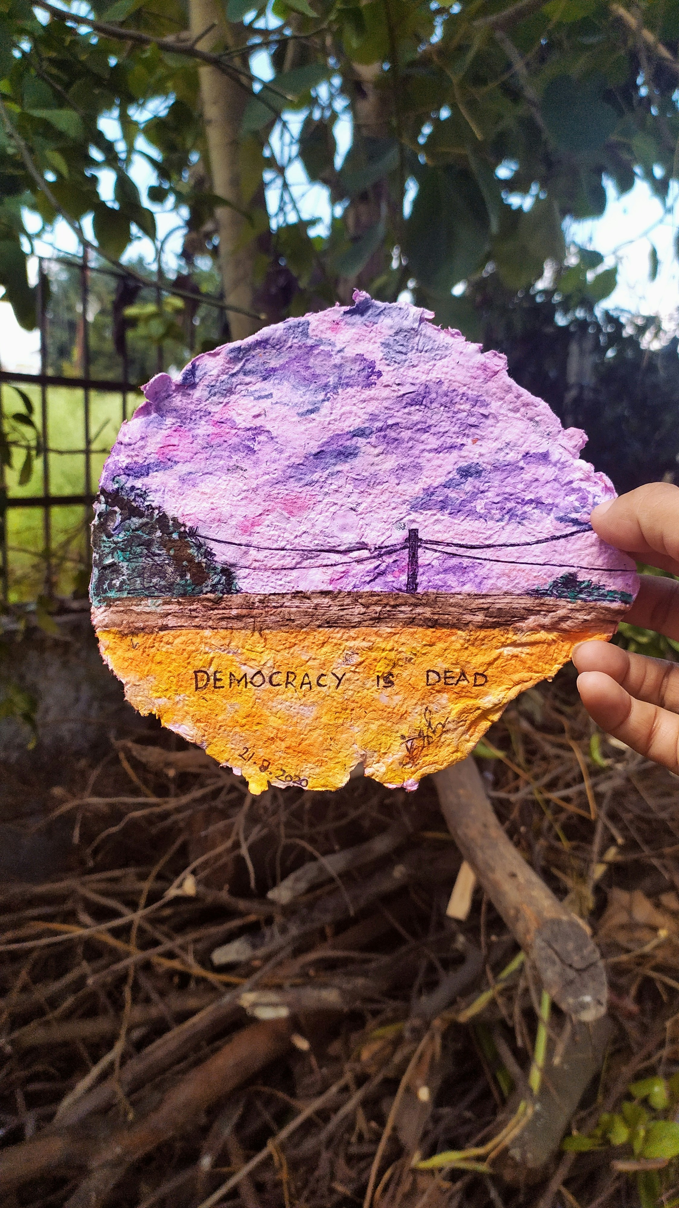 Democracy Is Dead on a Painted Disk: A Tiny Protest in Color and Light
