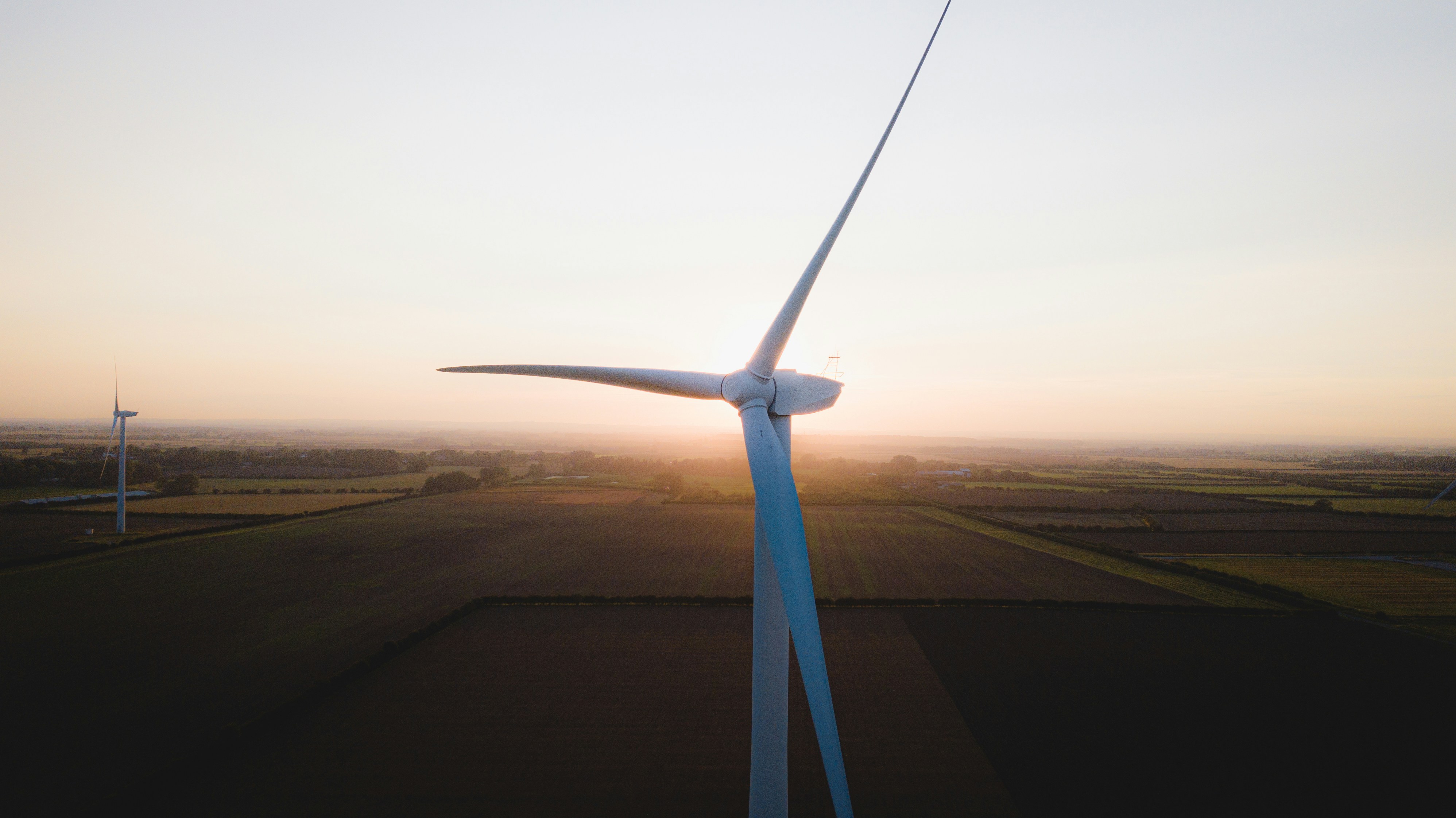 White wind turbine on brown field during daytime photo – Free Machine ...