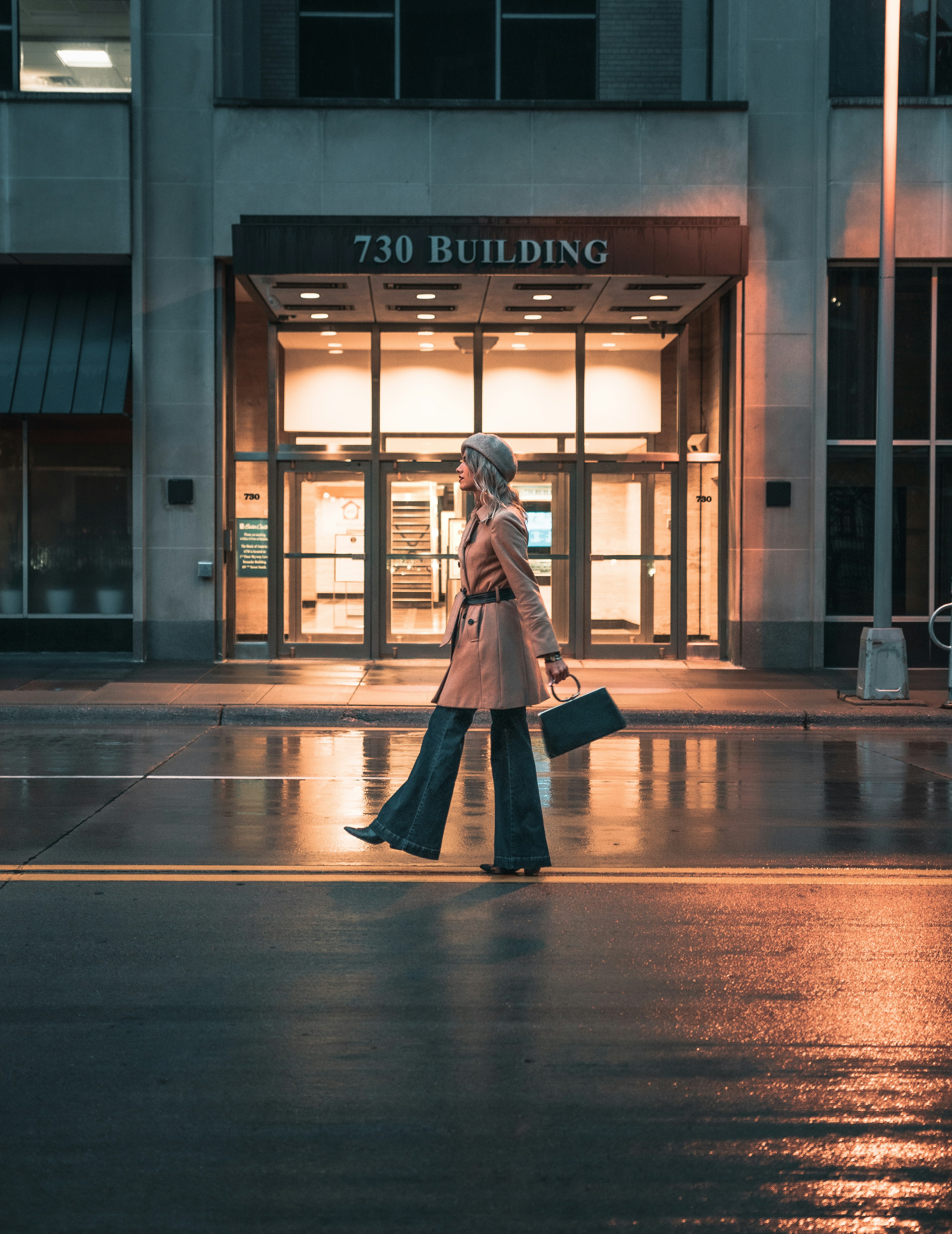 Midnight Crossing in Front of 730 Building’s Warm Entrance