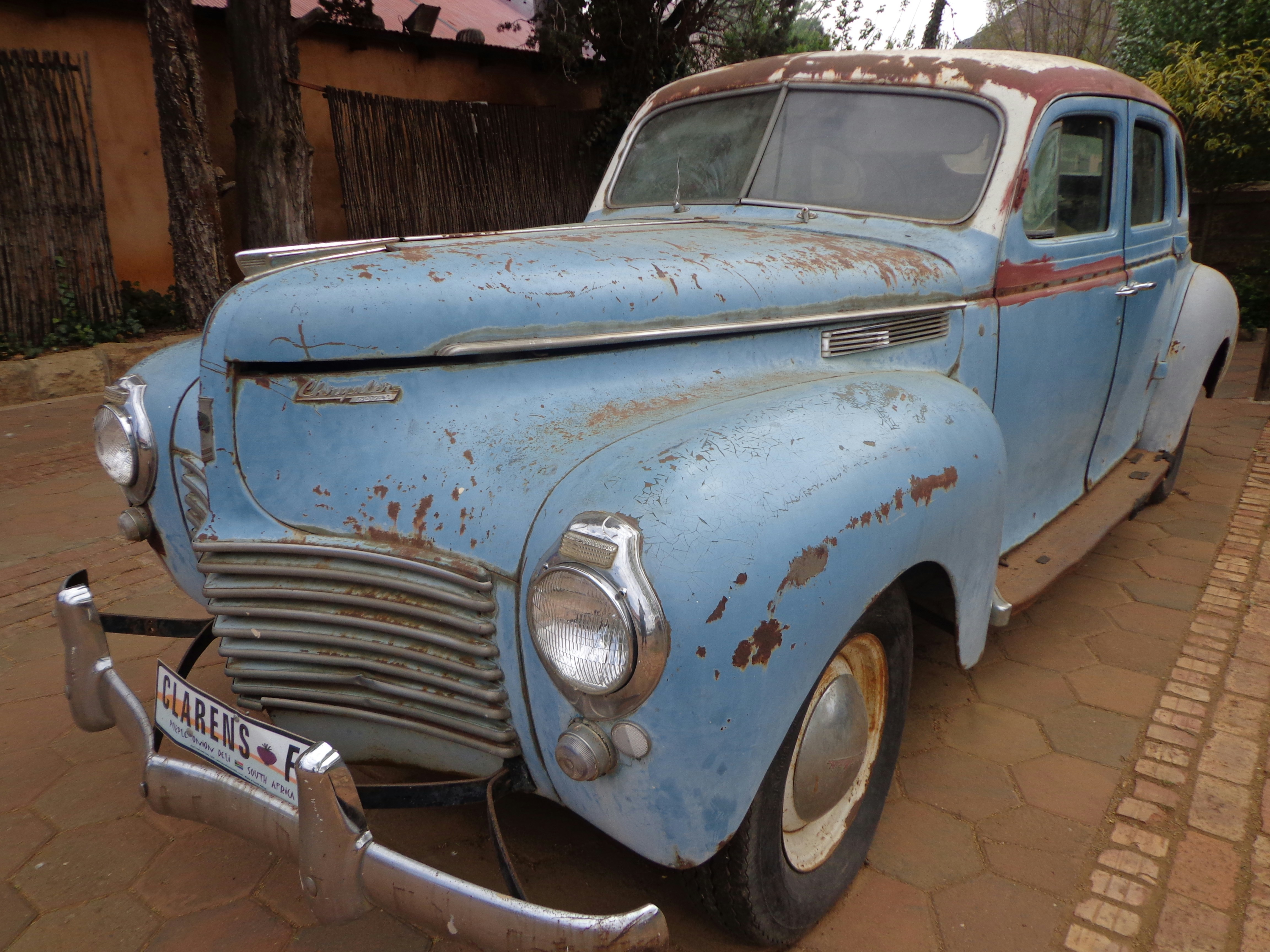 Weathered Classic: A Blue Chevrolet Rusted by Time