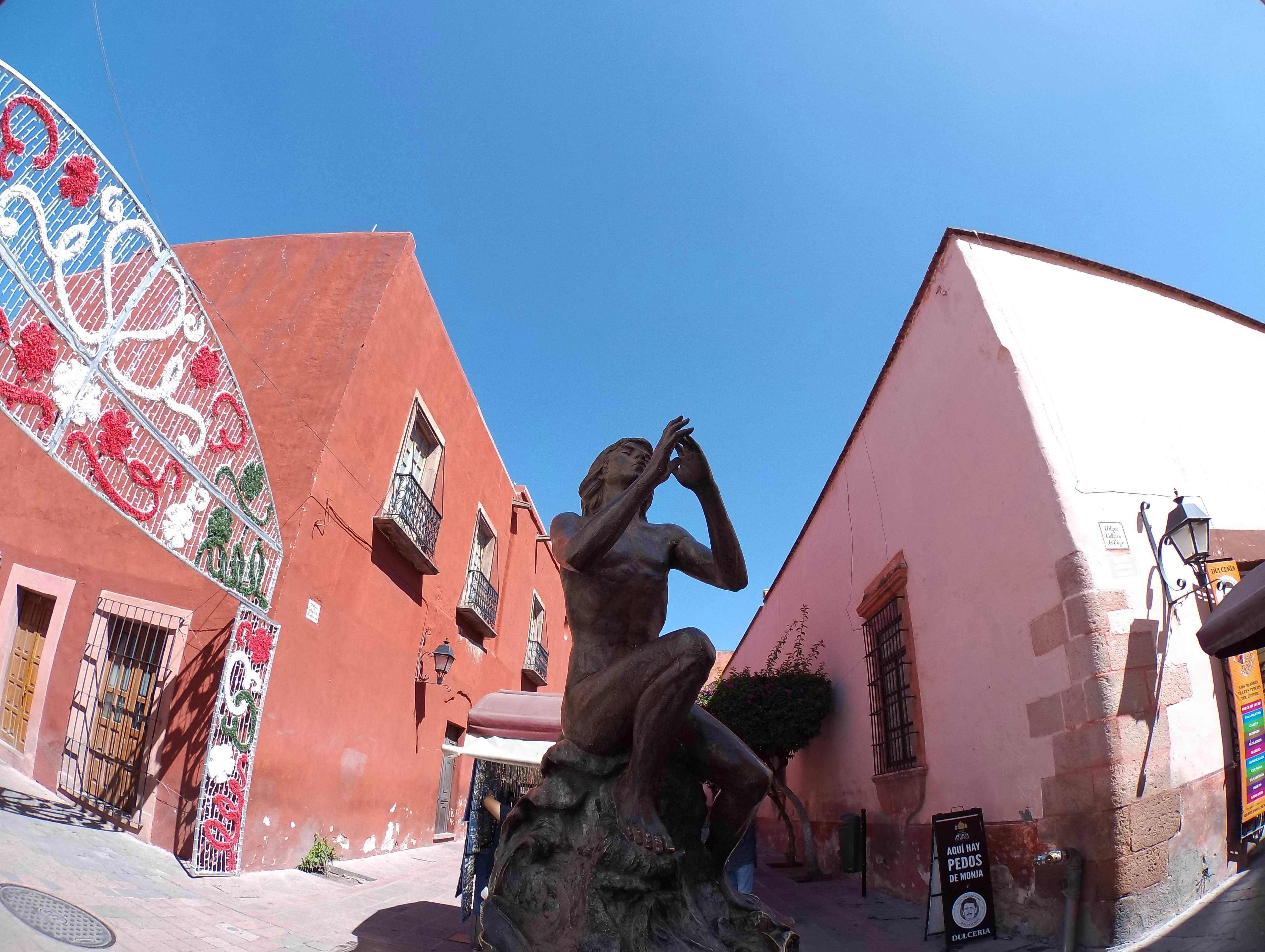 Sculptural Silhouette Amidst Vibrant Facades