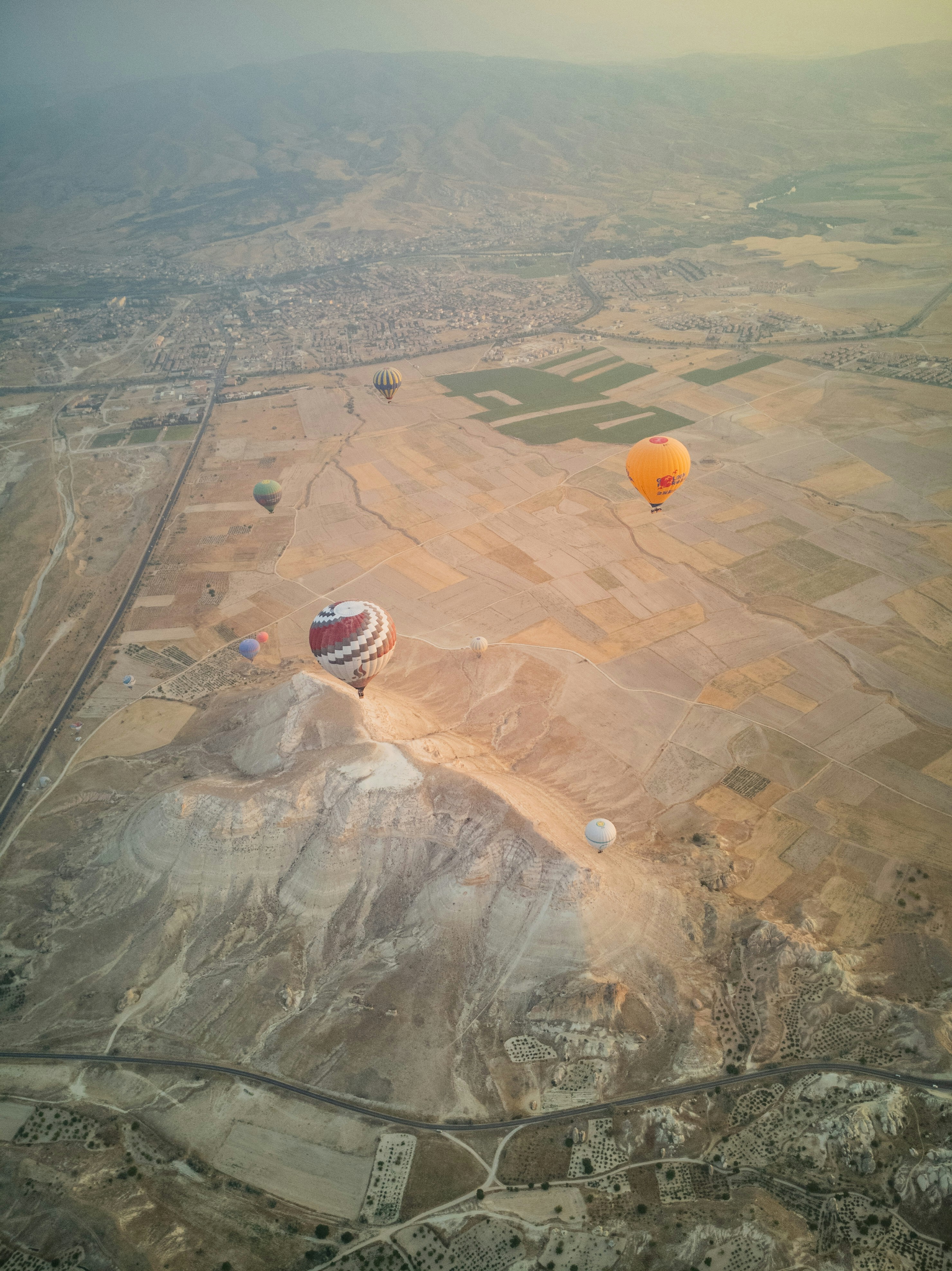 Ventures Above the Arid Quilt: Balloons over Terraced Lands