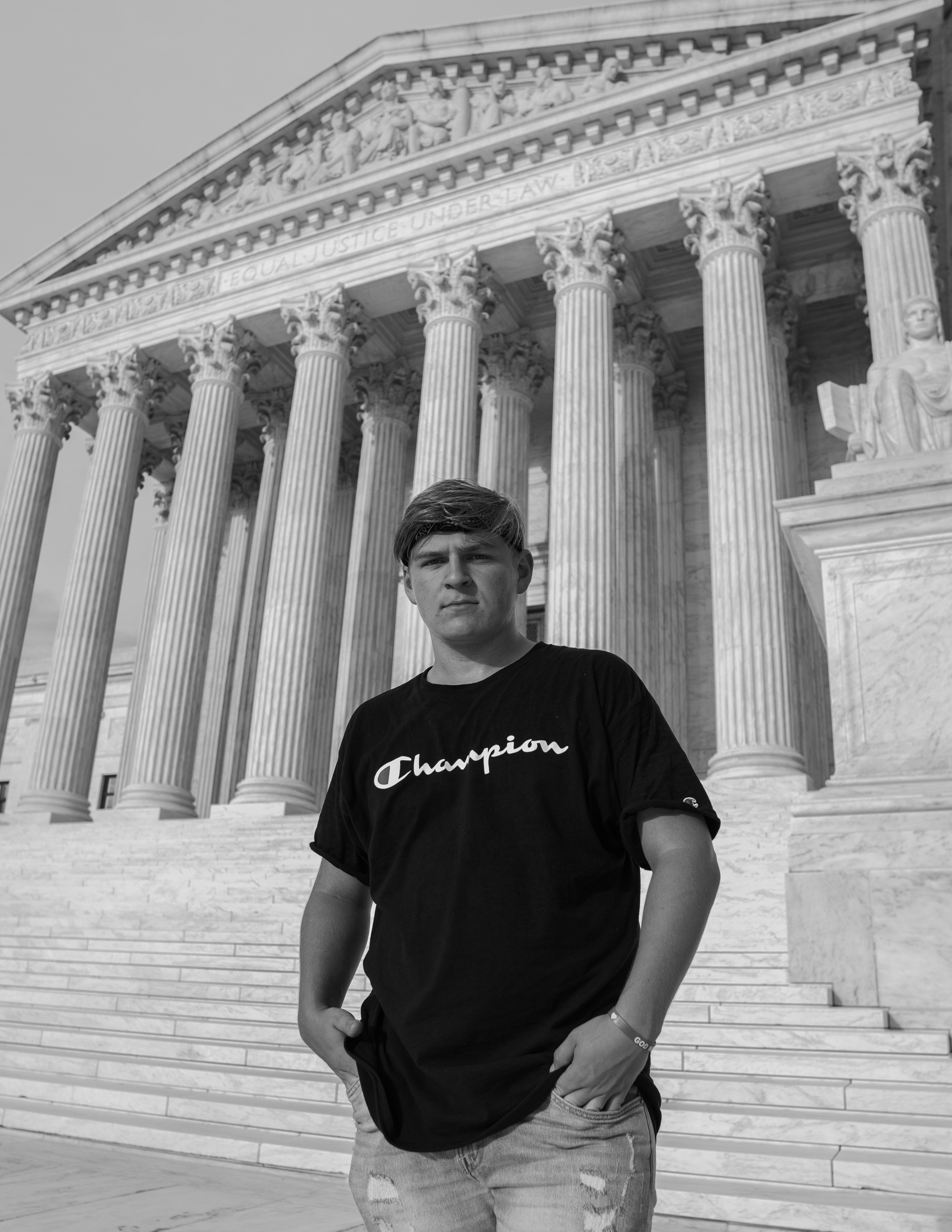 Portrait at the Marble Staircase: A Casual Moment Before a Neoclassical Colonnade