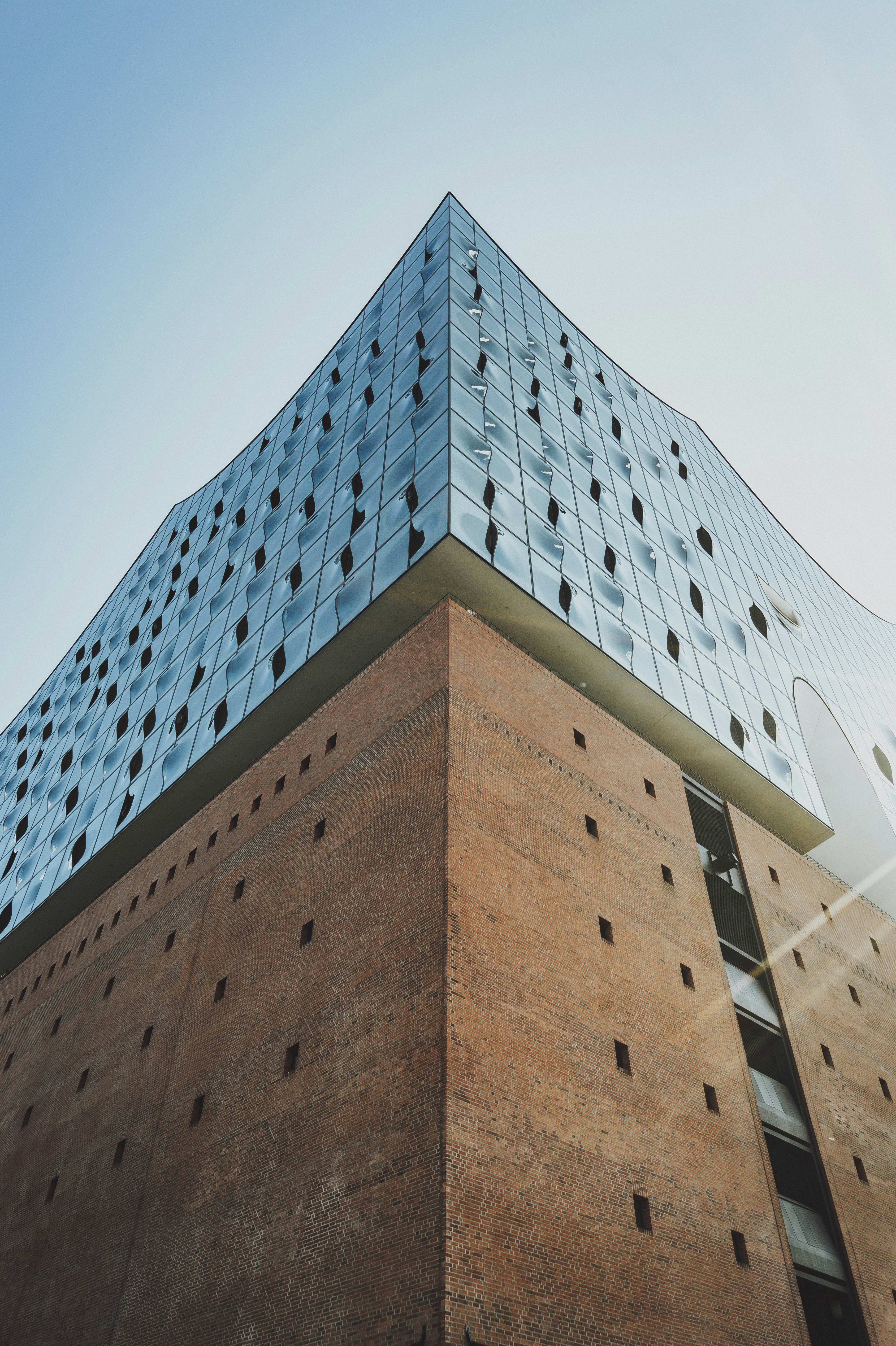 Cornered Geometry: Glass Tower Meets Brick Facade