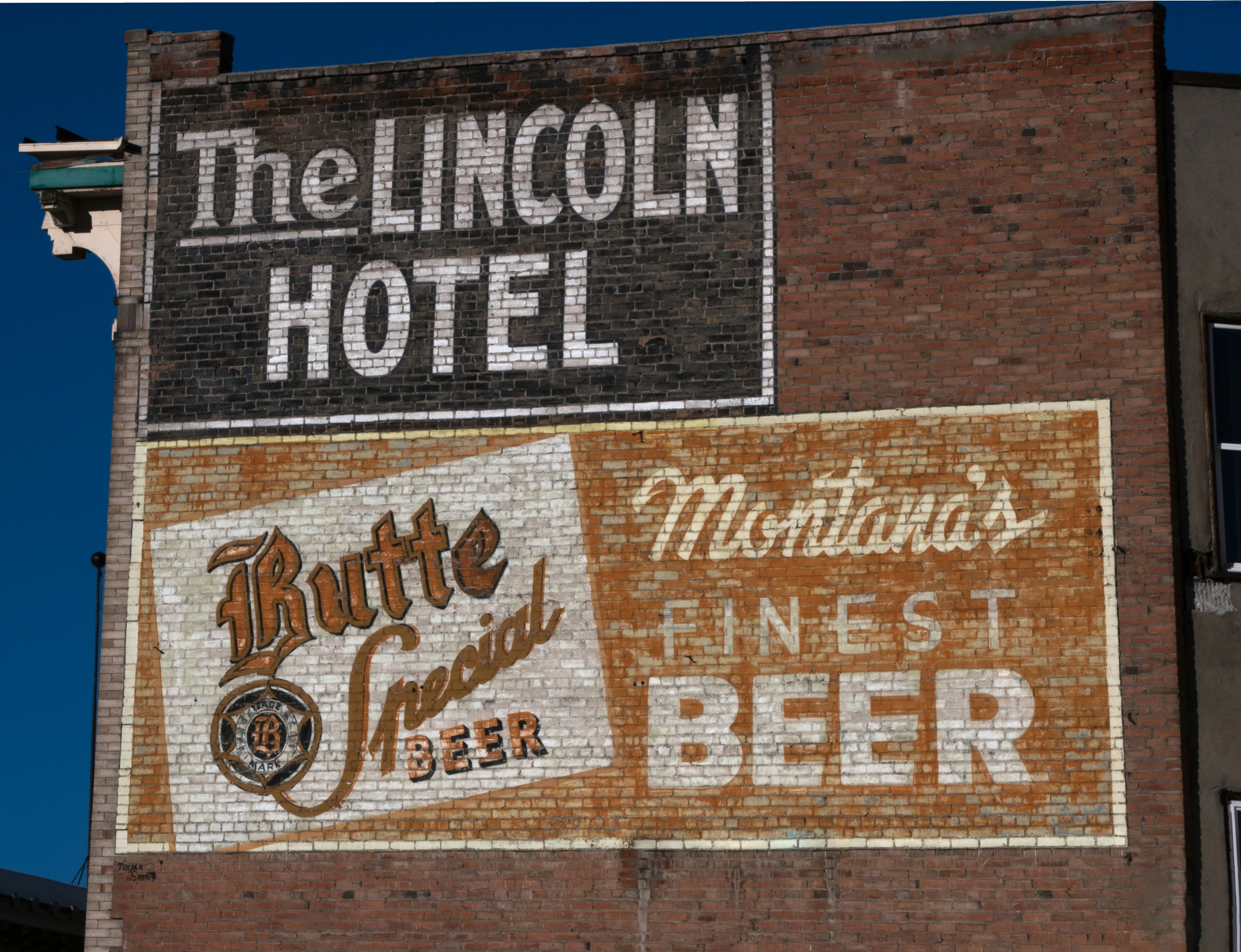 Echoes of the Past: Vintage Advertisements on Brick