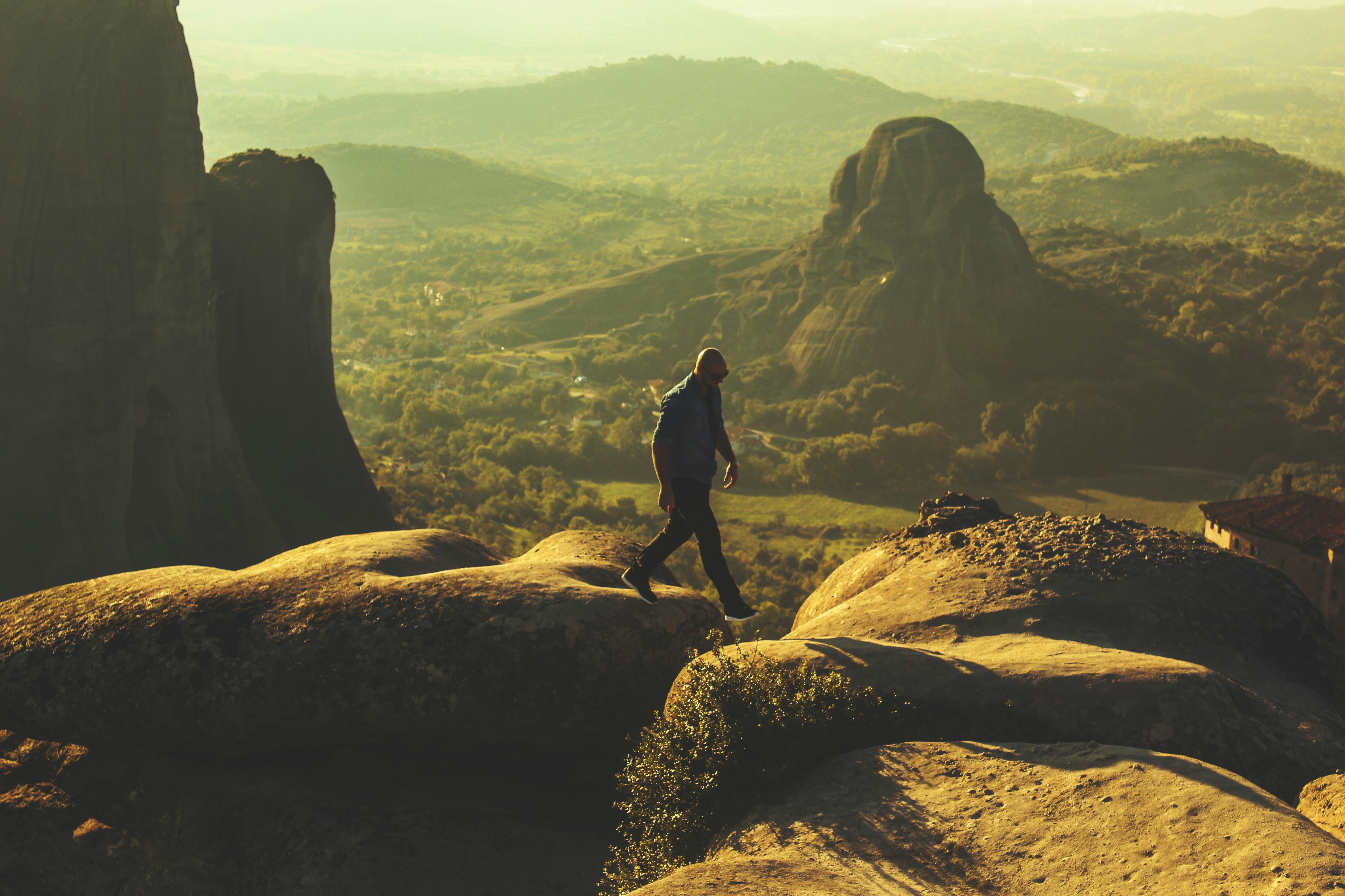 Sunlit Wanderer Amidst Ancient Stones