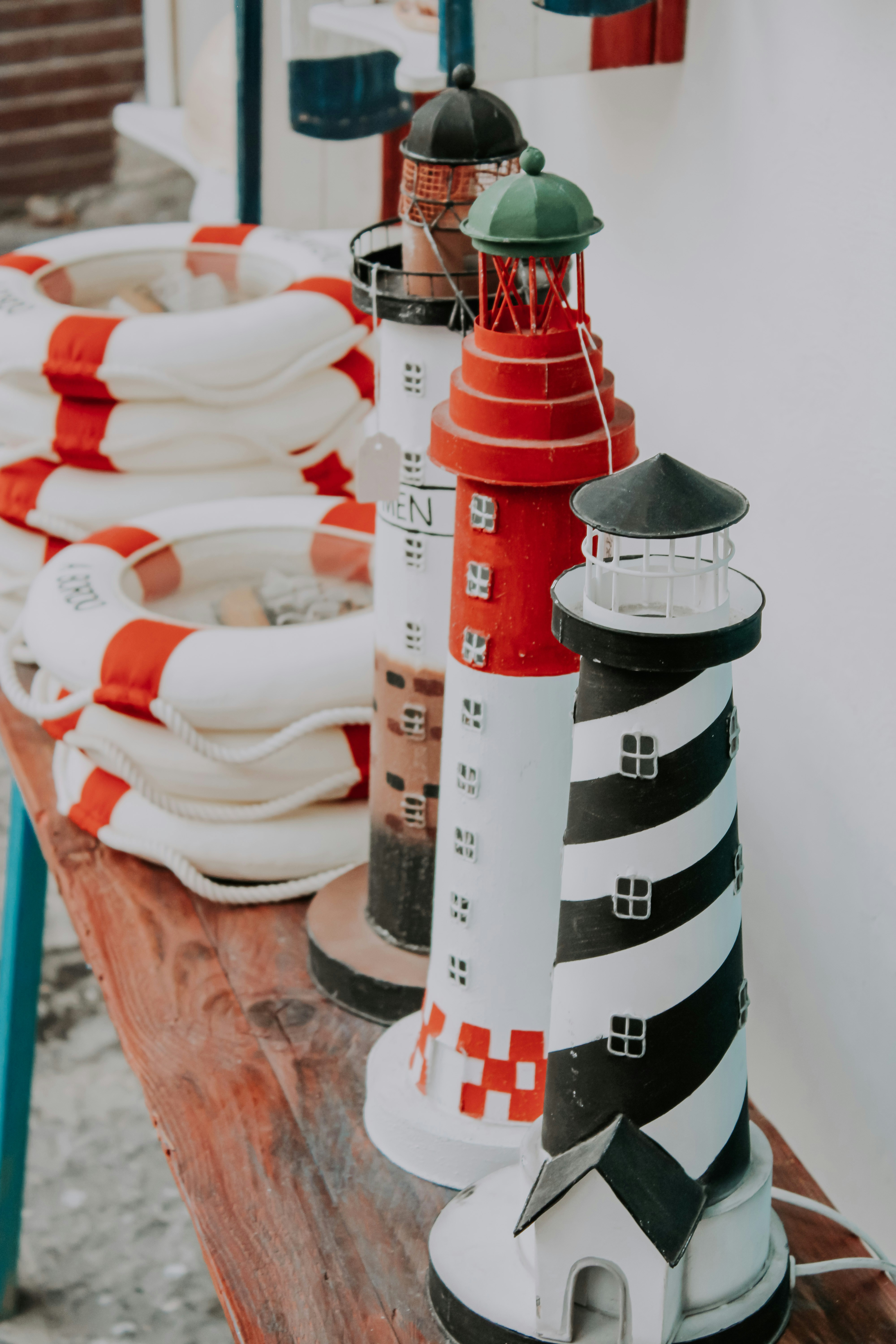 Coastal Beacon Minis: A Row of Cartoonish Lighthouses Guarding the Tides