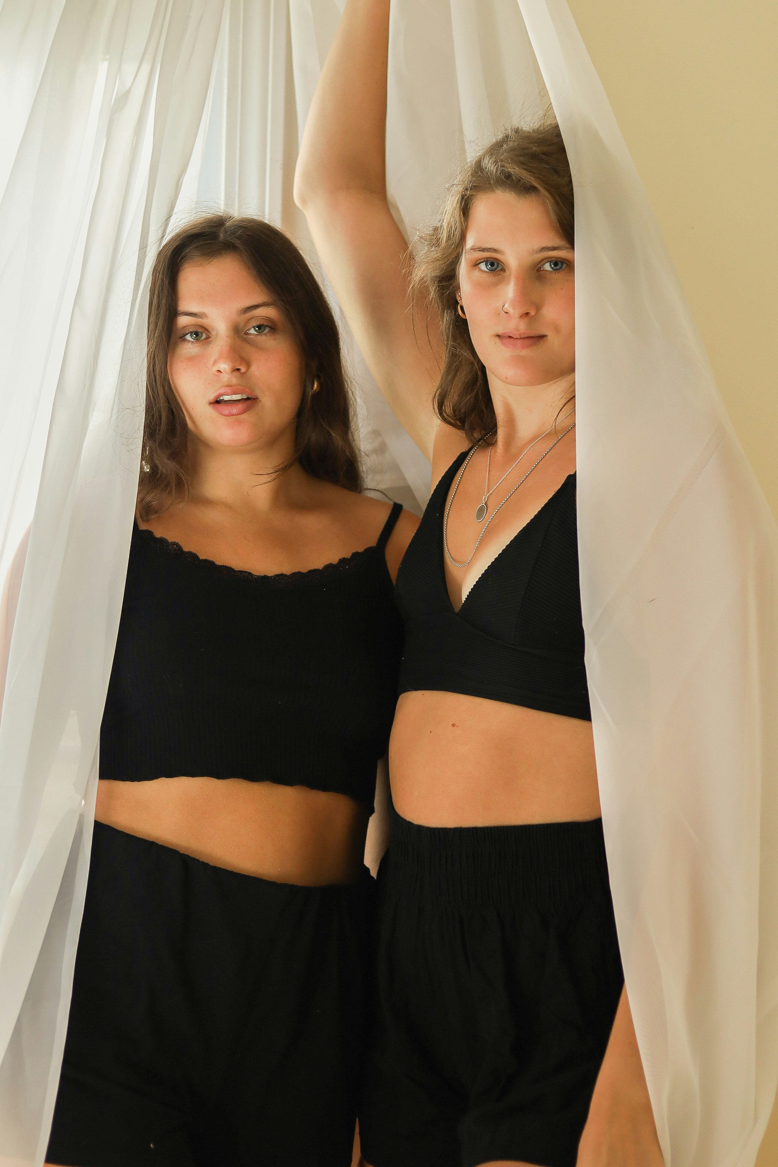 2 women in black tank top and black skirt photo – Free Brown Image on ...