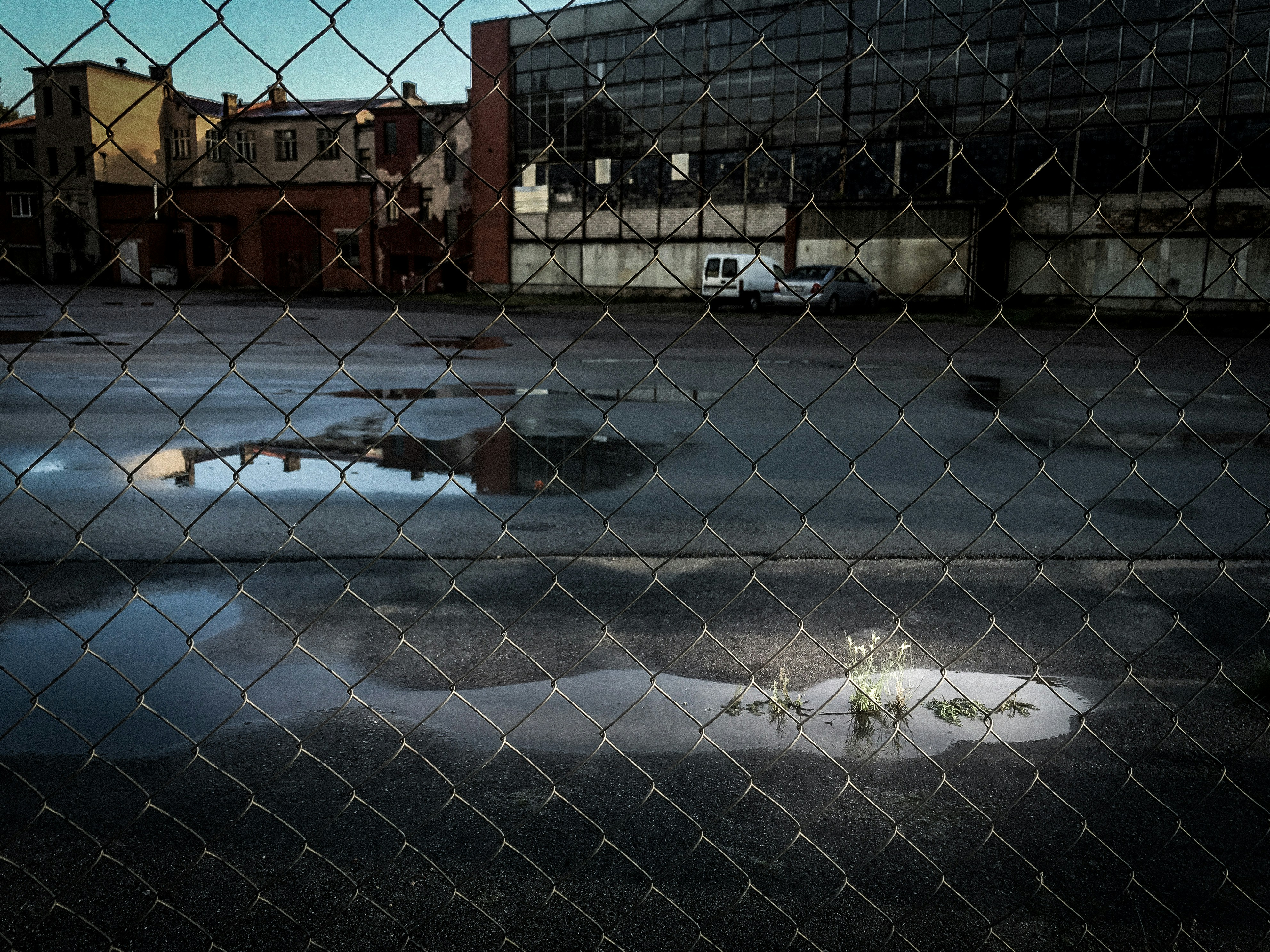 black metal fence near brown concrete building during daytime