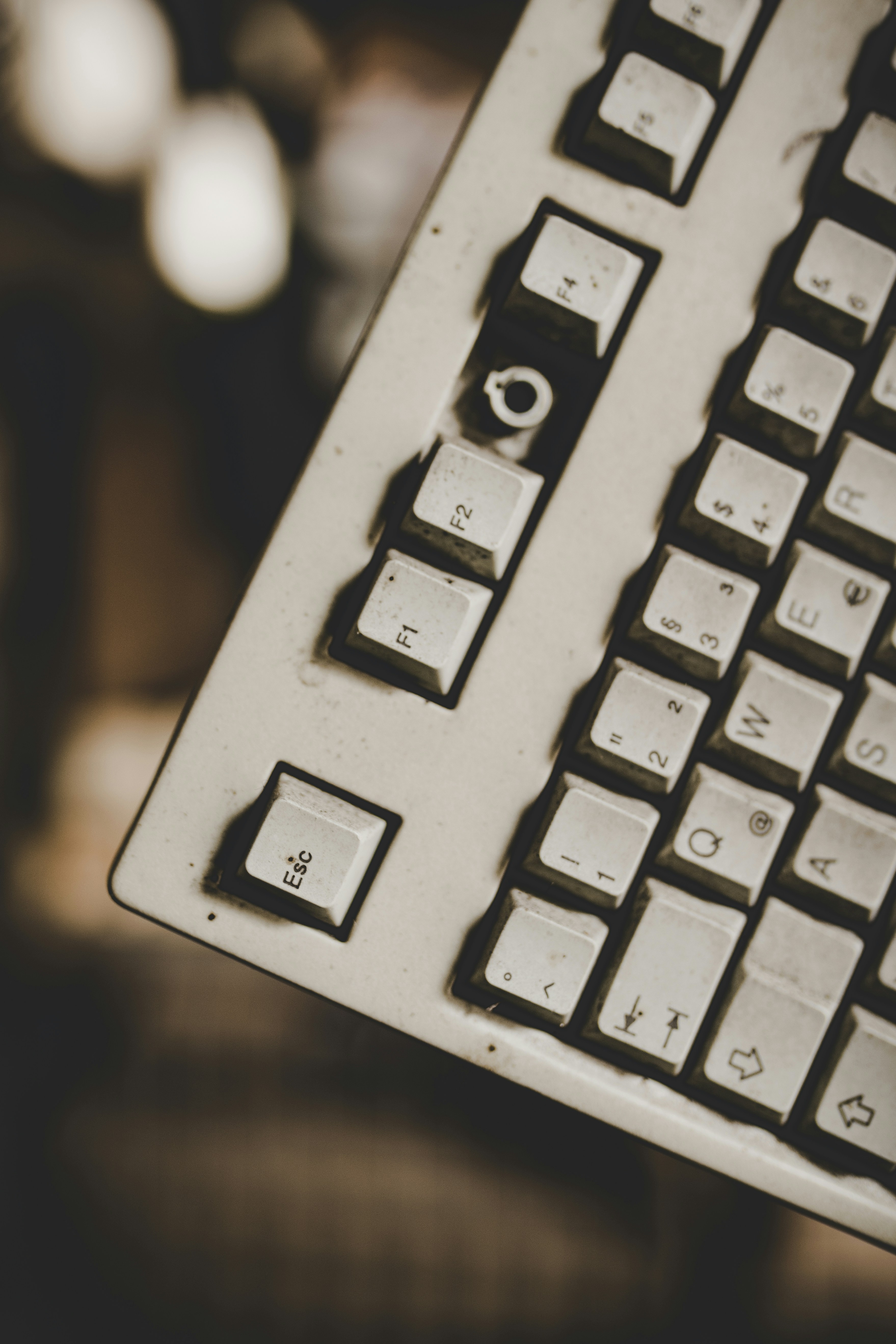 Worn Keyboard, Quiet Focus: A Close-Up on the Edge of Technology