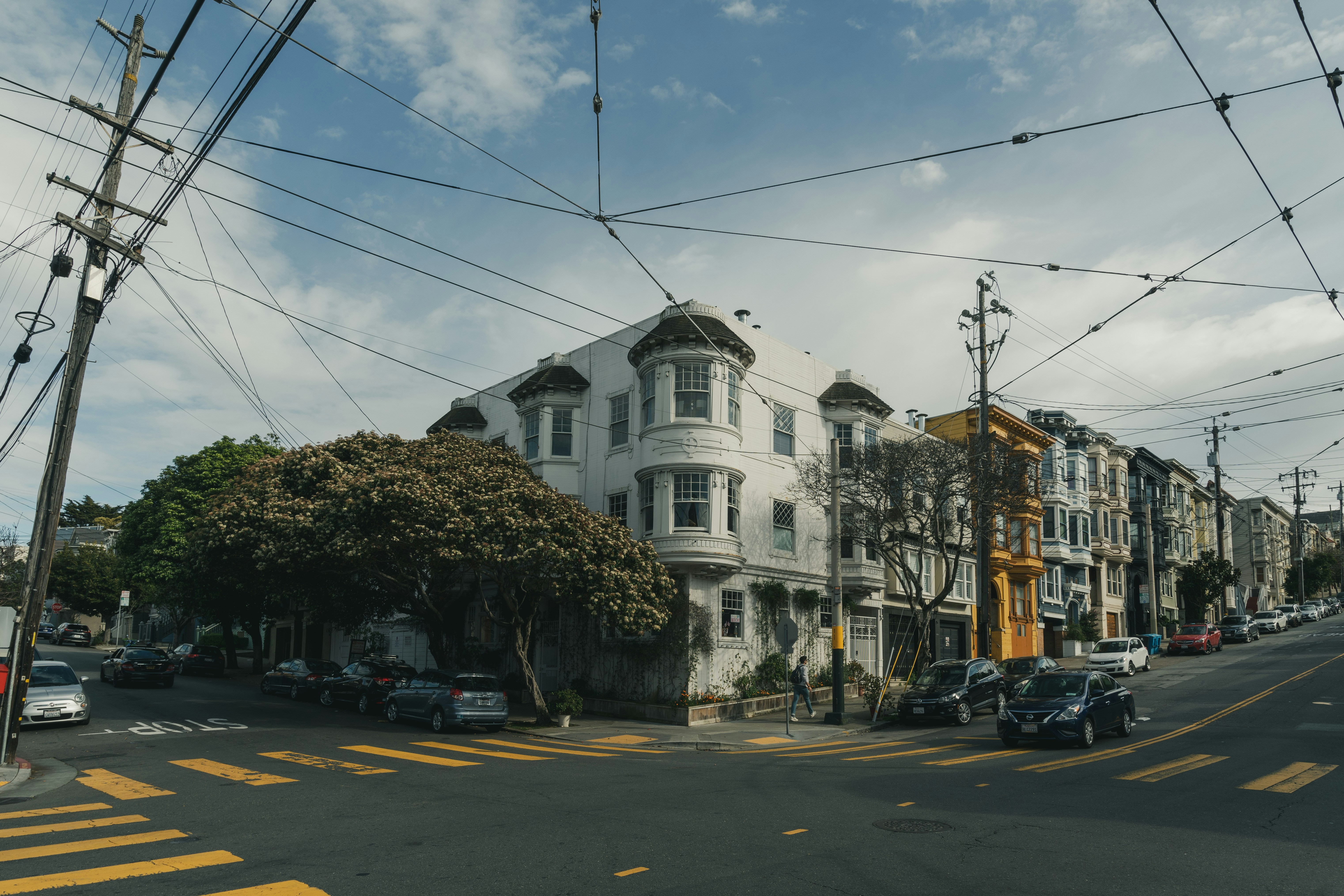 White concrete building near road during daytime photo – Free Car Image ...