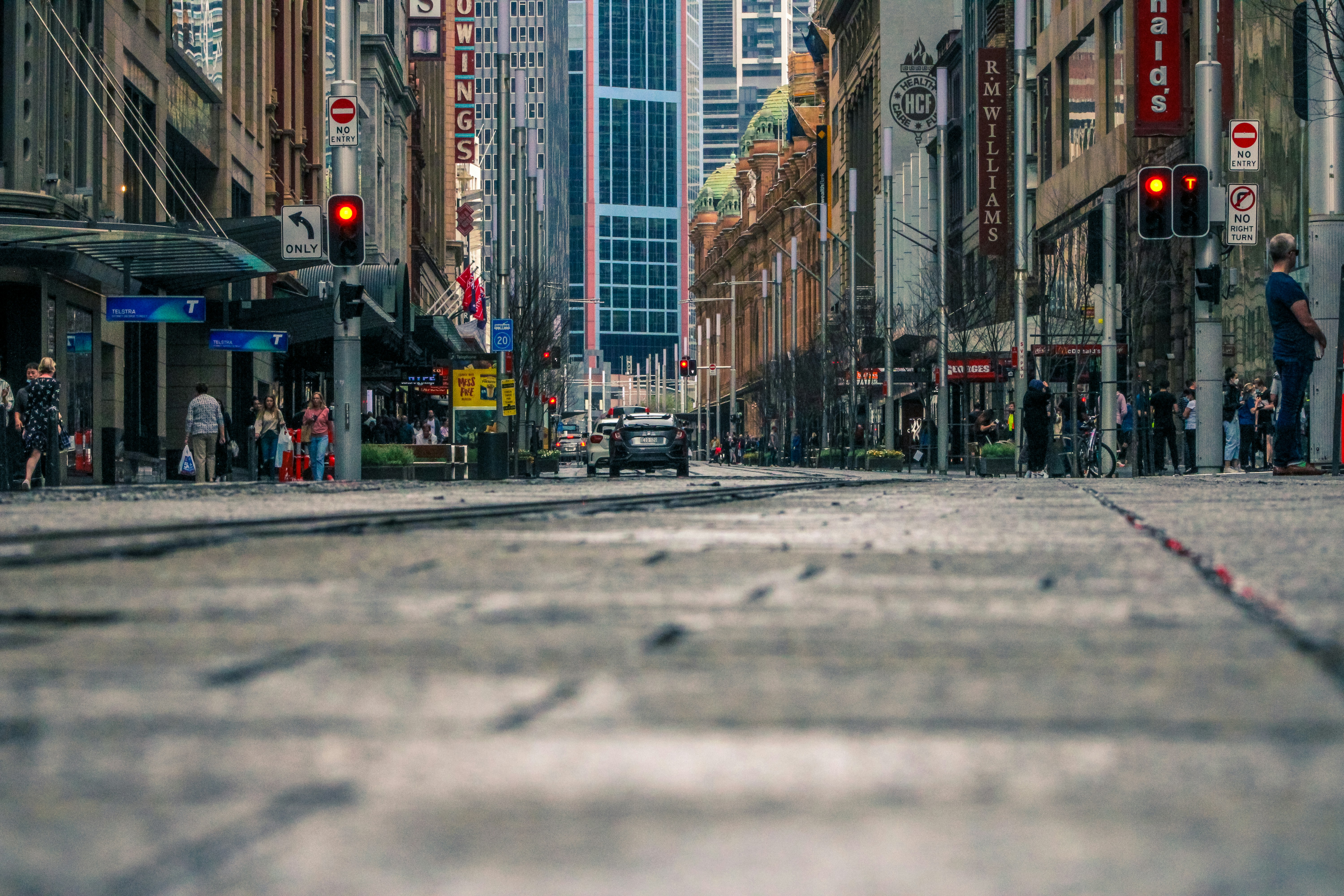 Gray concrete road between high rise buildings during daytime photo ...
