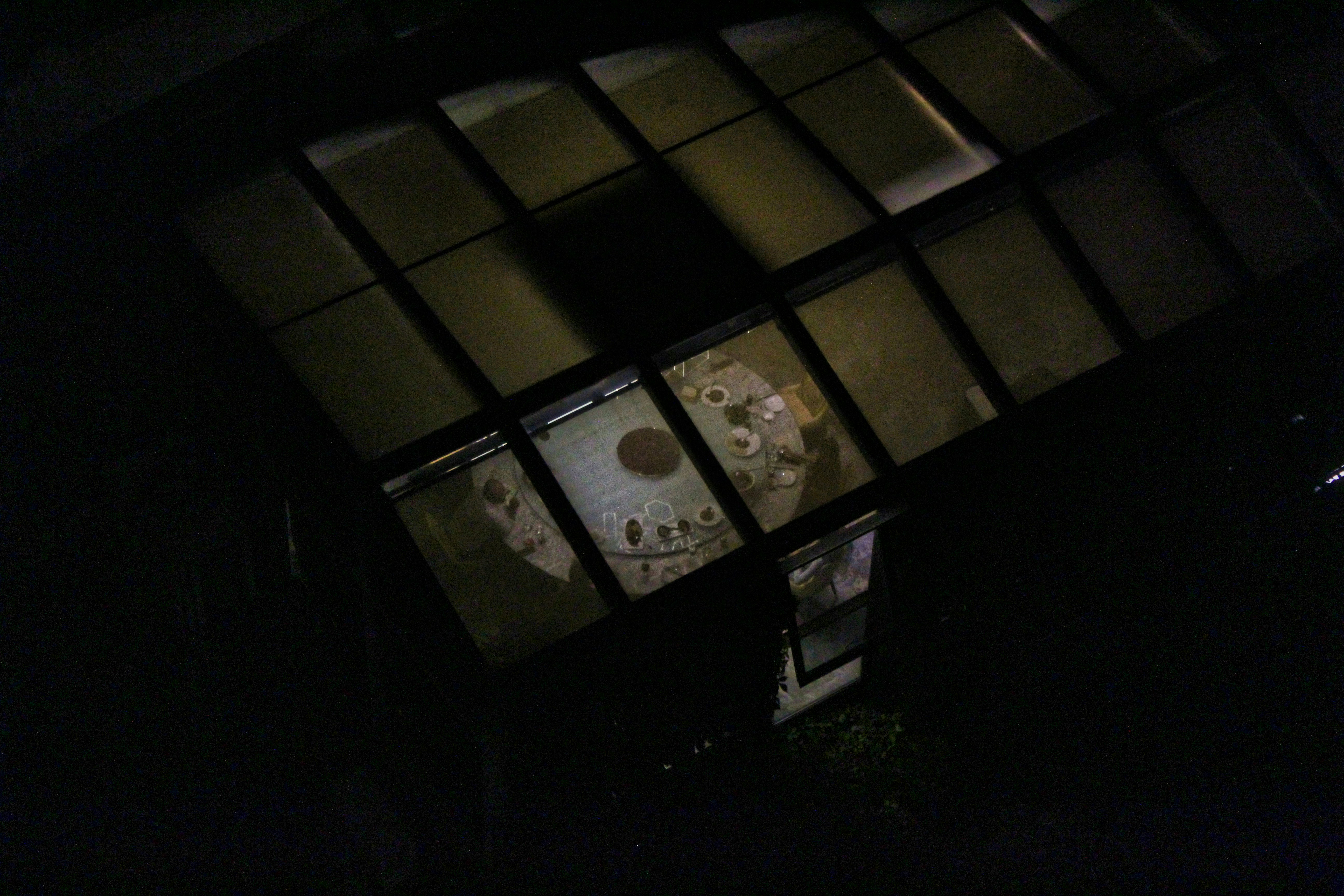 Circular Glow Through a Diagonal Window Grid