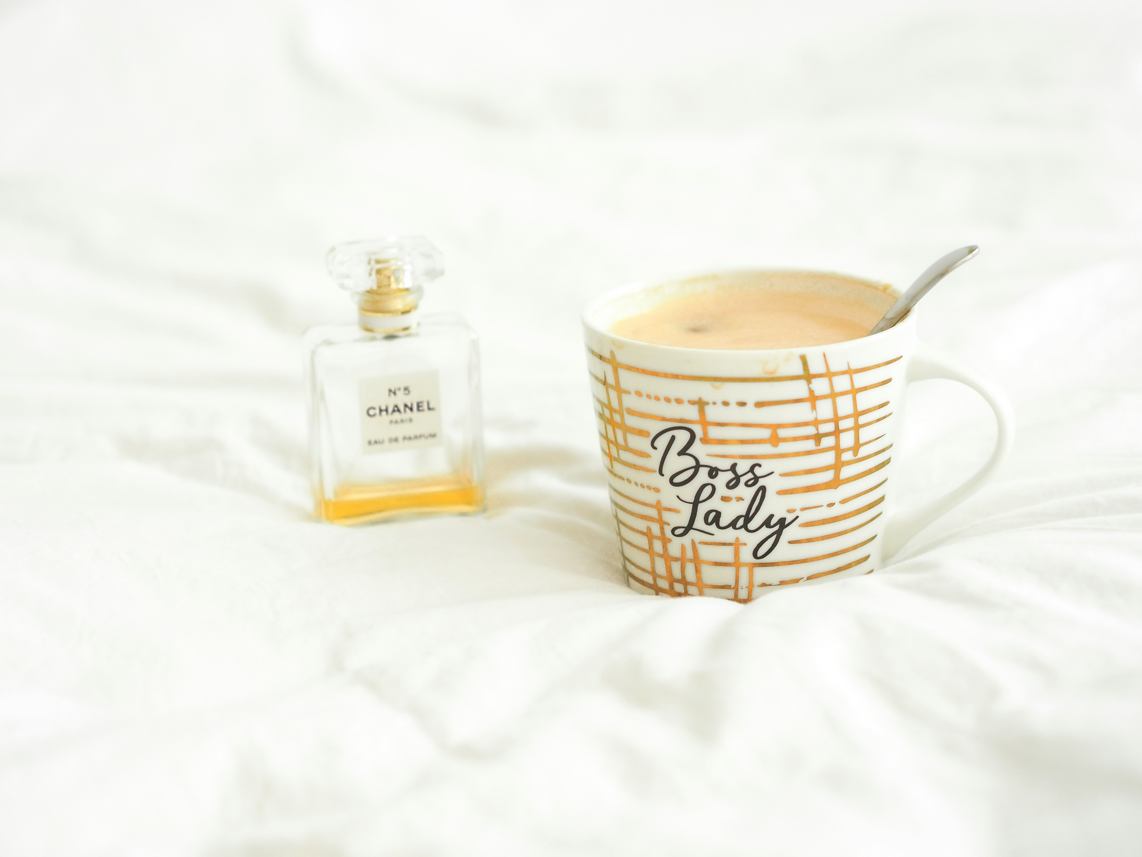 A Quiet Morning Brew: Chanel and Coffee on a Soft Linen Bed