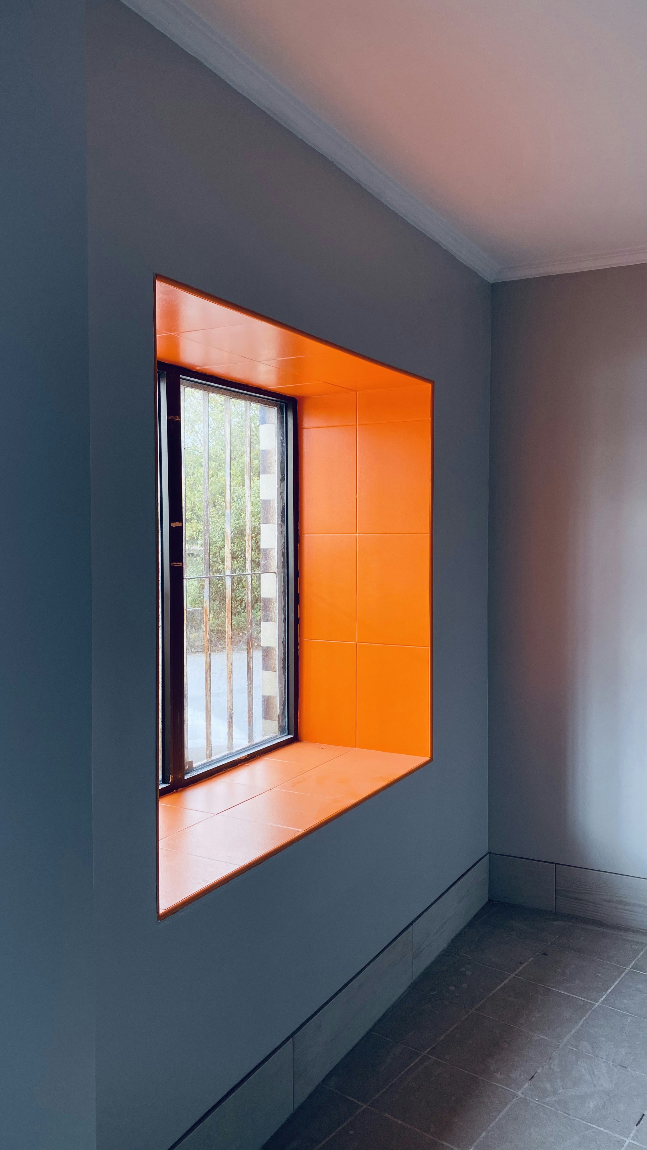 Orange Nook: A Window in a Blue Room