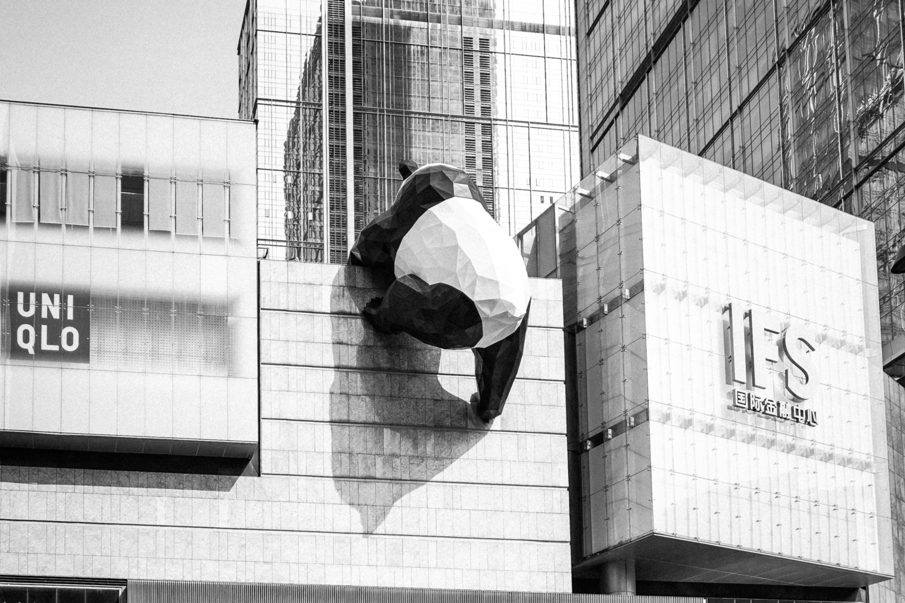 Urban Prism: A Faceted Shadow Vanish on a City Facade