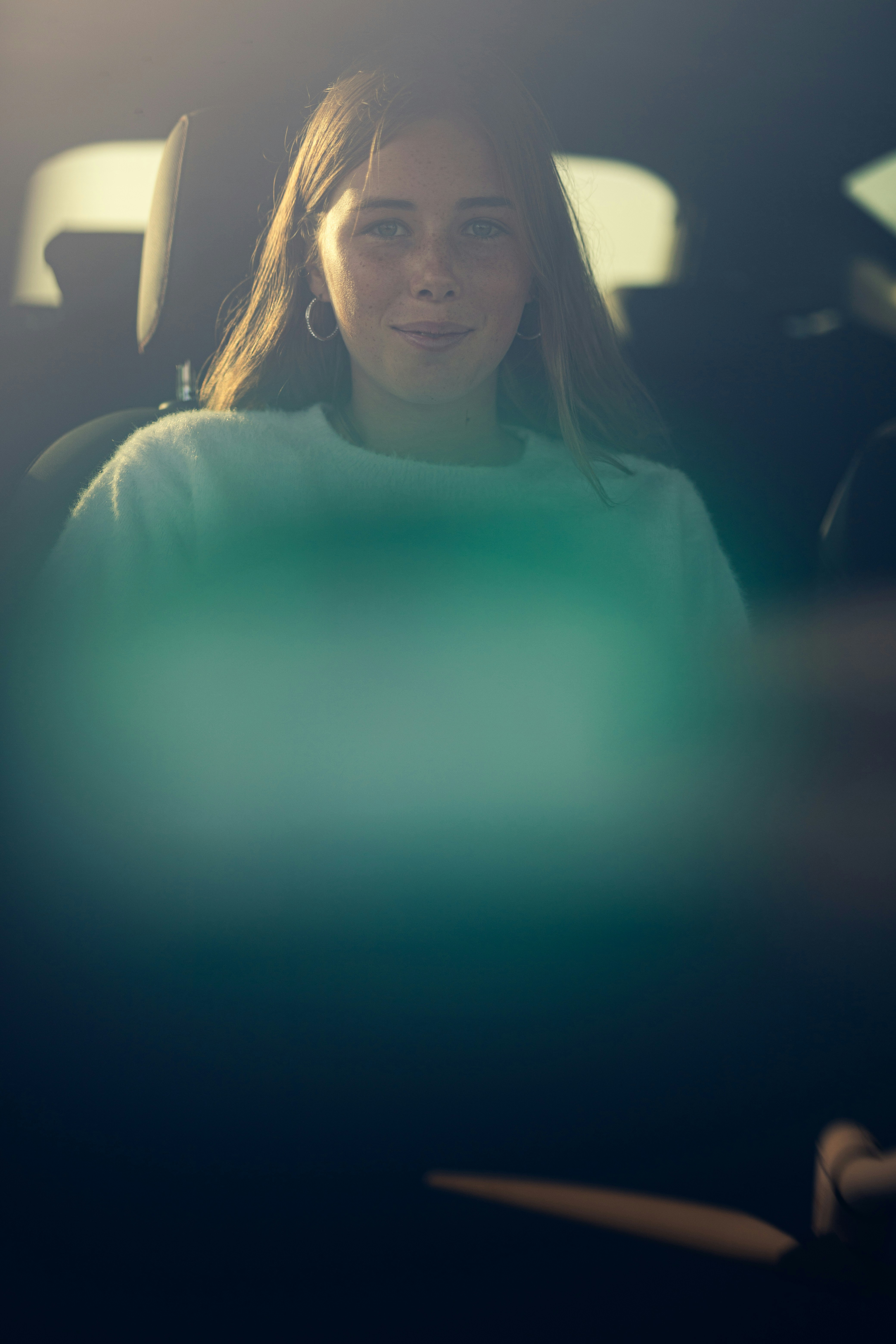 woman in green turtleneck shirt