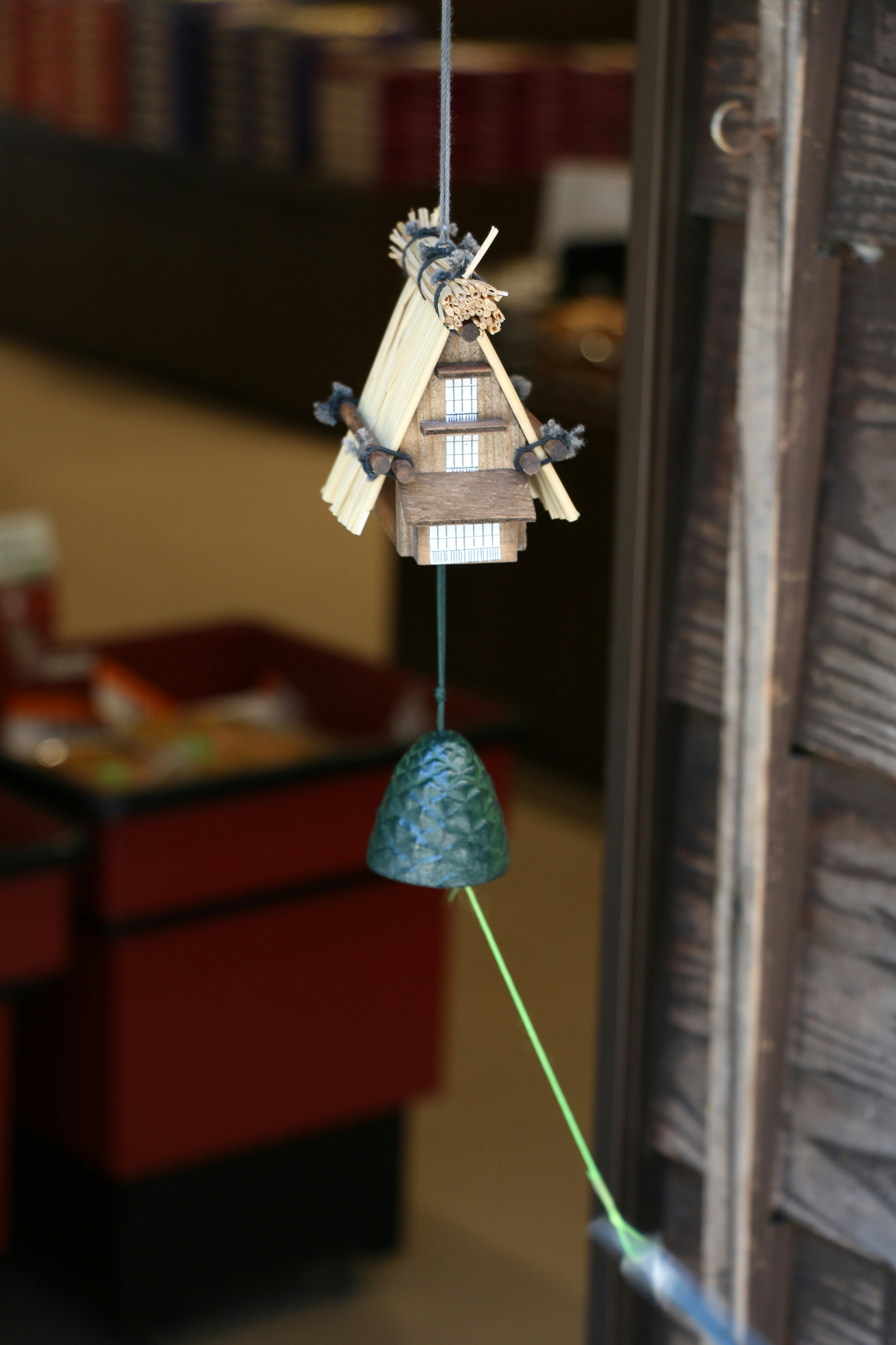 Hanging Toy House as Quiet Centerpiece in Doorway