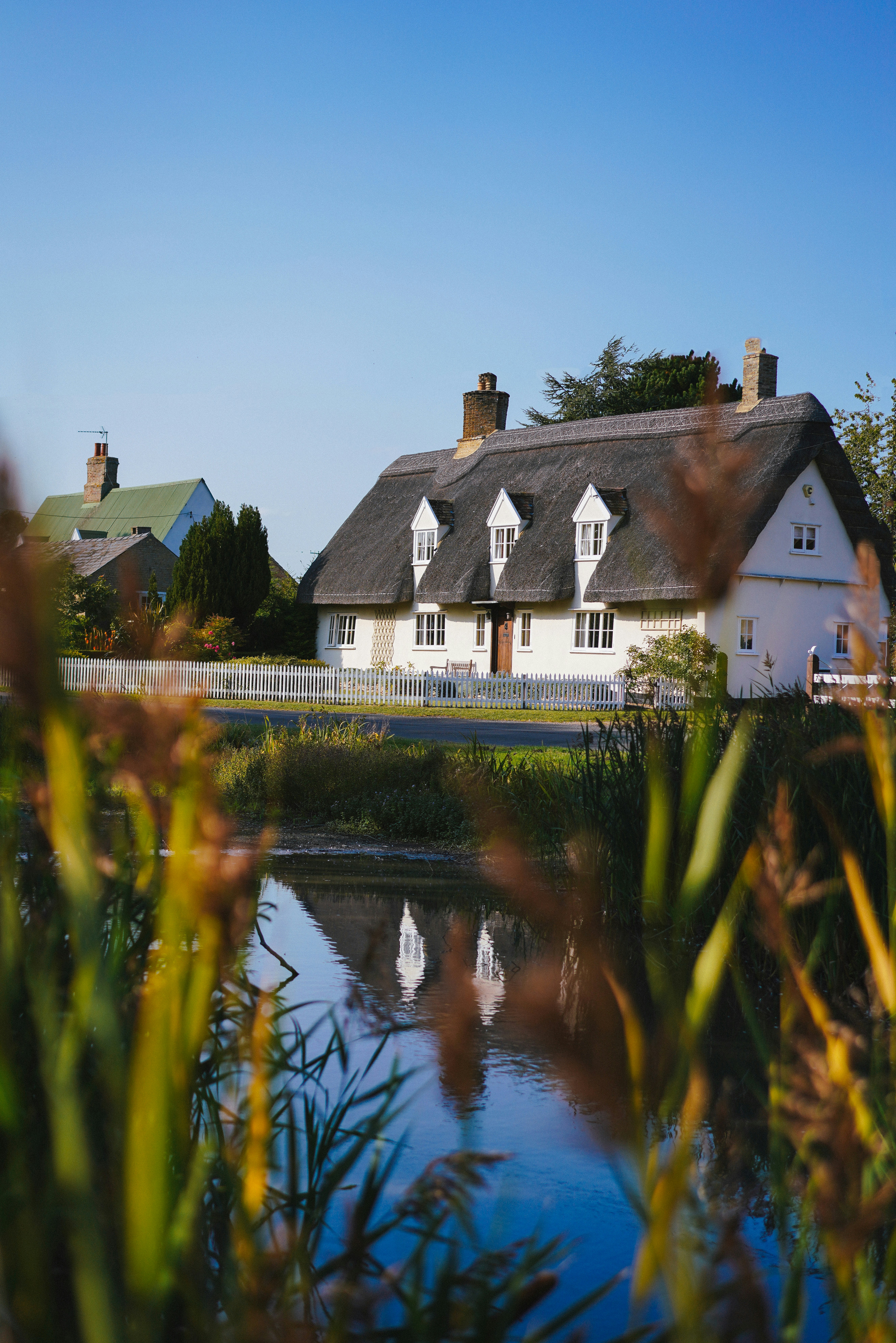 White and brown house beside river during daytime photo – Free Ely ...