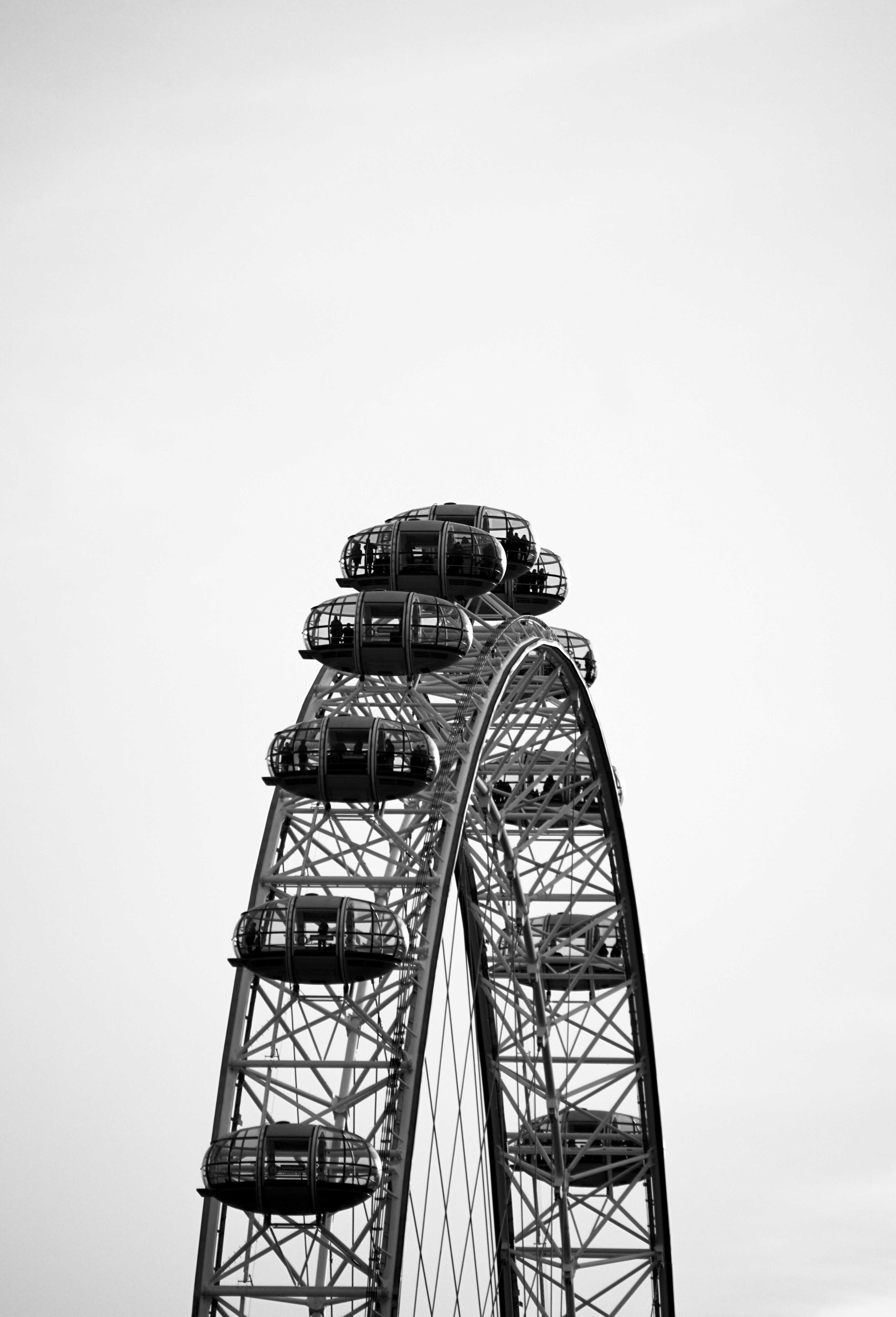 Monochrome Lattice: The Ferris Wheel's Skeleton Against a Serene Sky