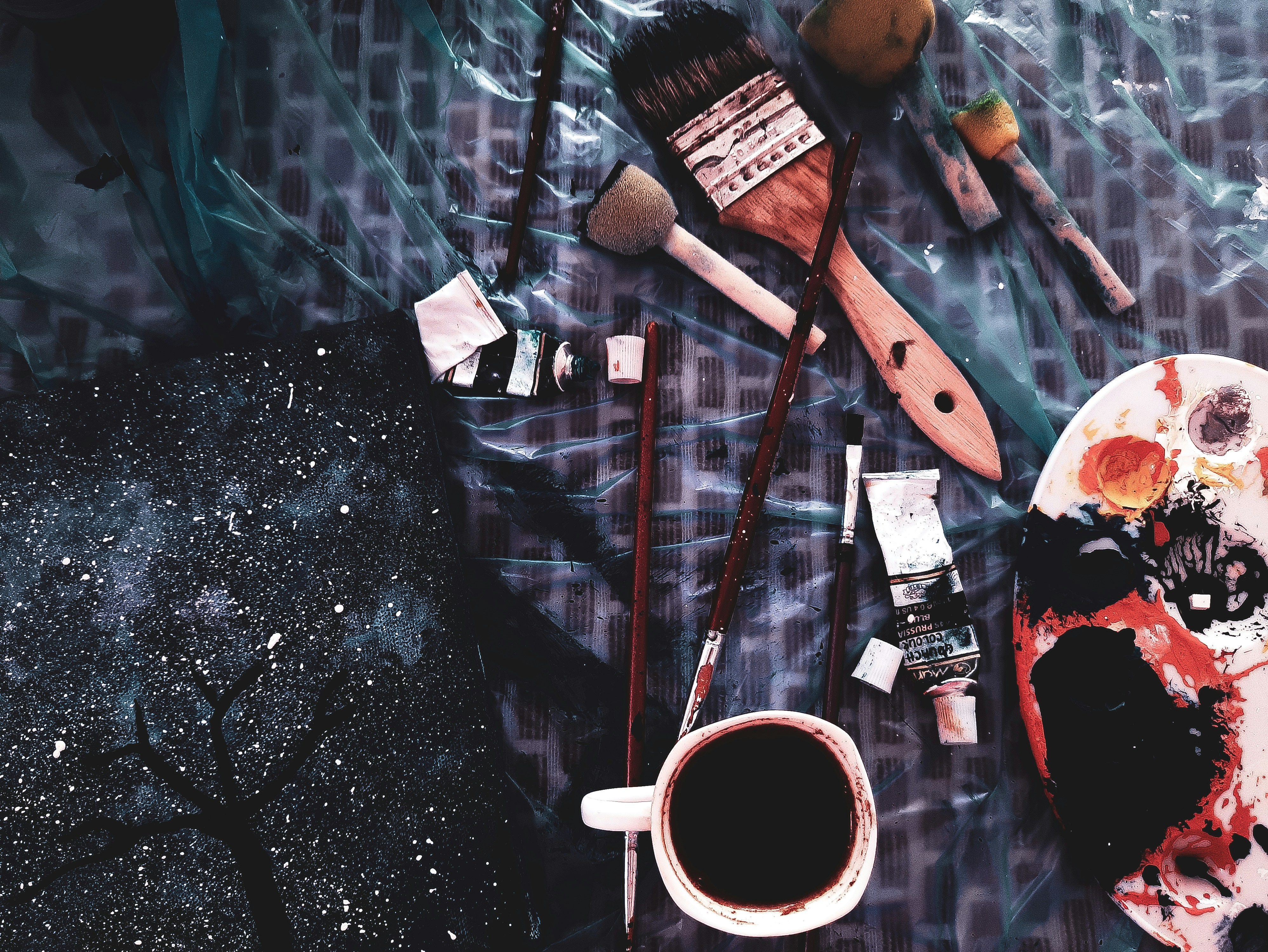 Midnight Roast on a Painter's Table: Coffee Centered Amid Brushes and Palette