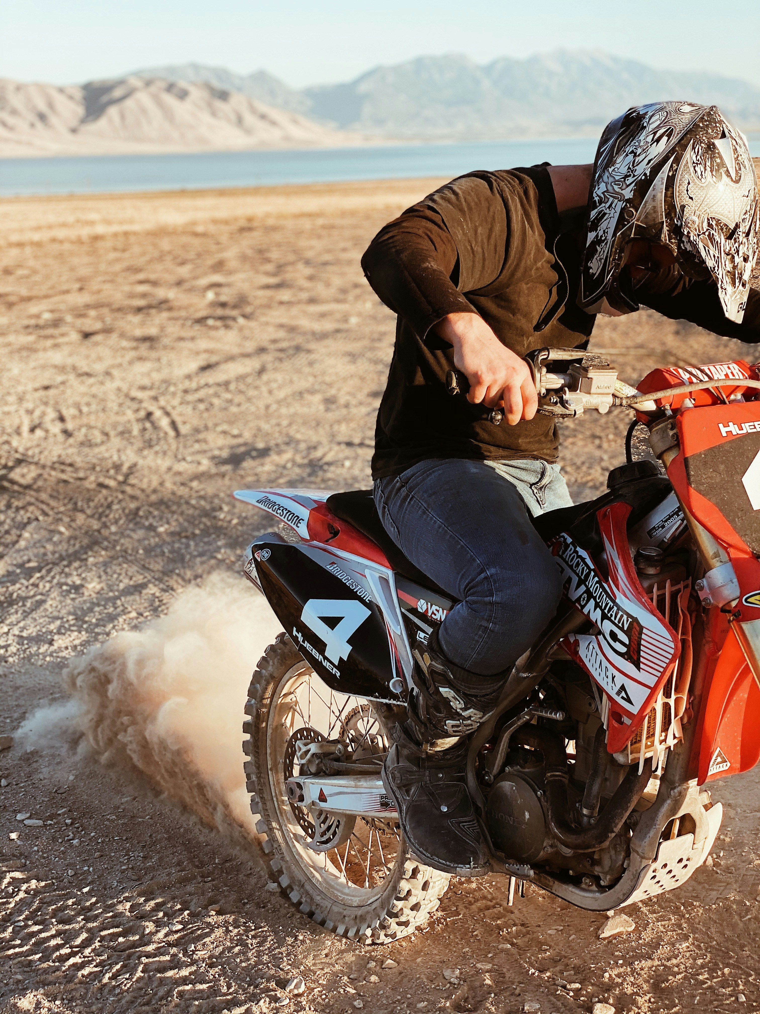 Desert Momentum: A Rider Commands Dust and Horizon on an Orange KTM