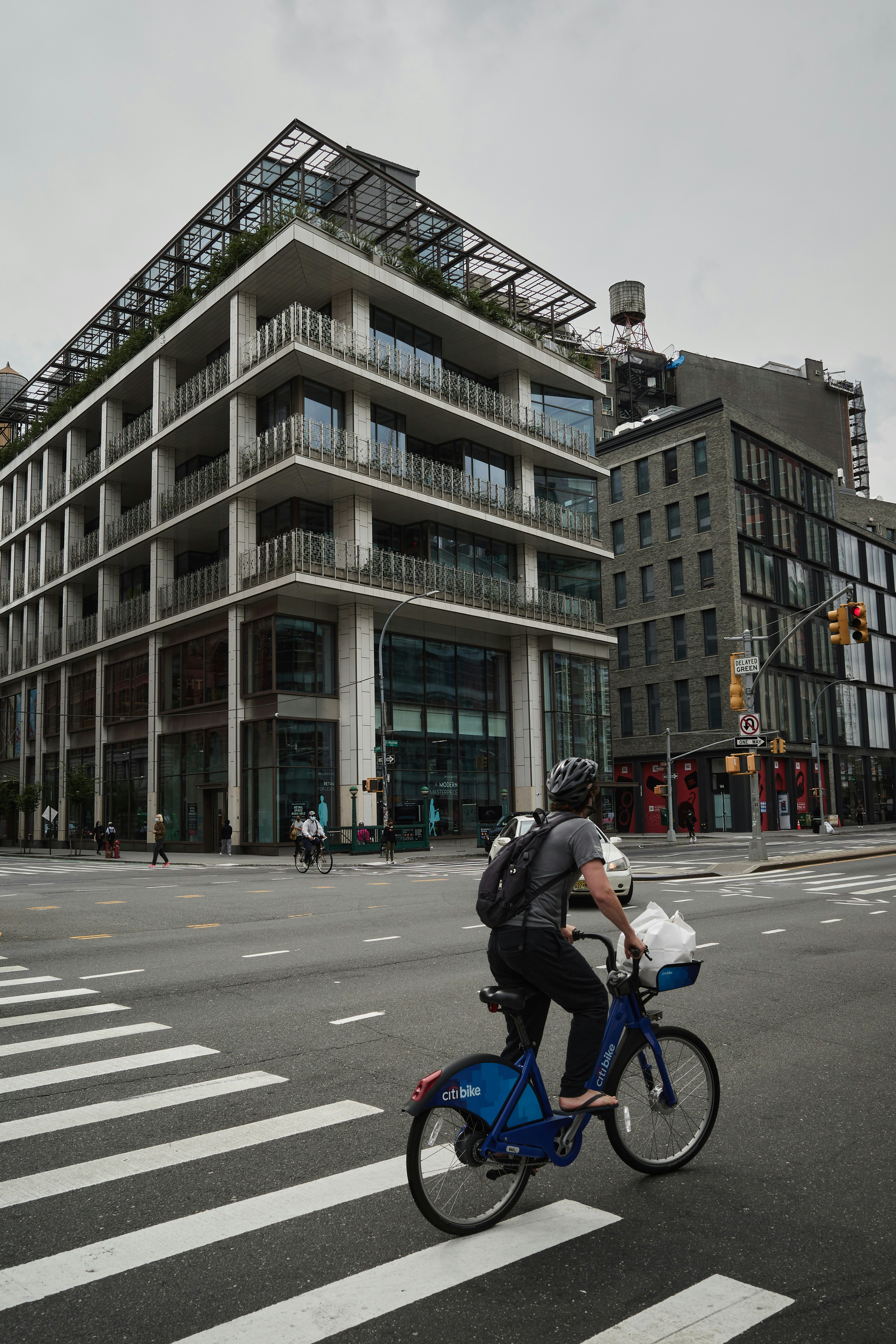 Cyclist Navigates SoHo's Geometric Jungle