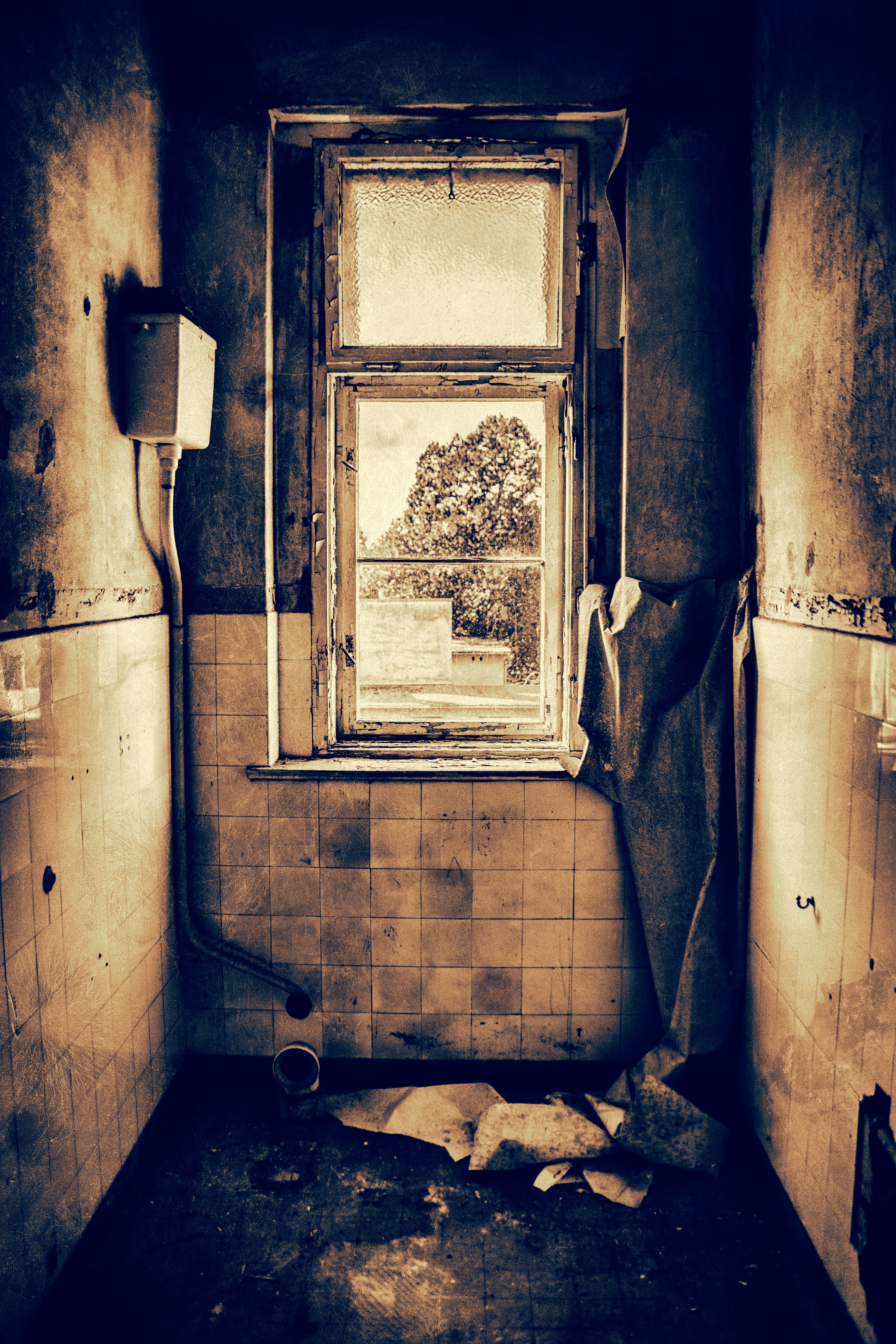 Abandoned Window: Light Fractures in a Sunken Kitchen
