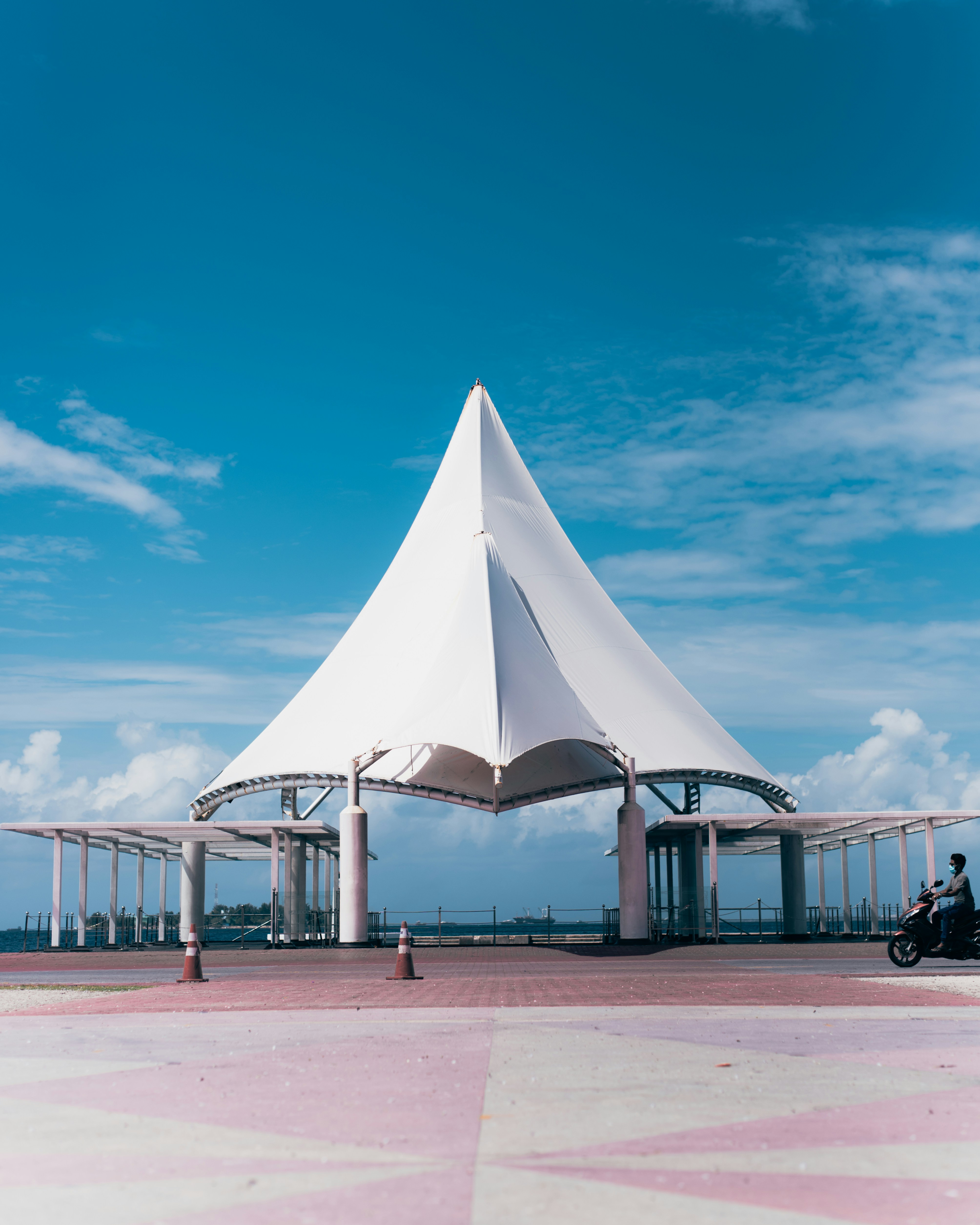 Sail-Pavilion at the Promenade: White Canopy Against a Clear Blue Sky