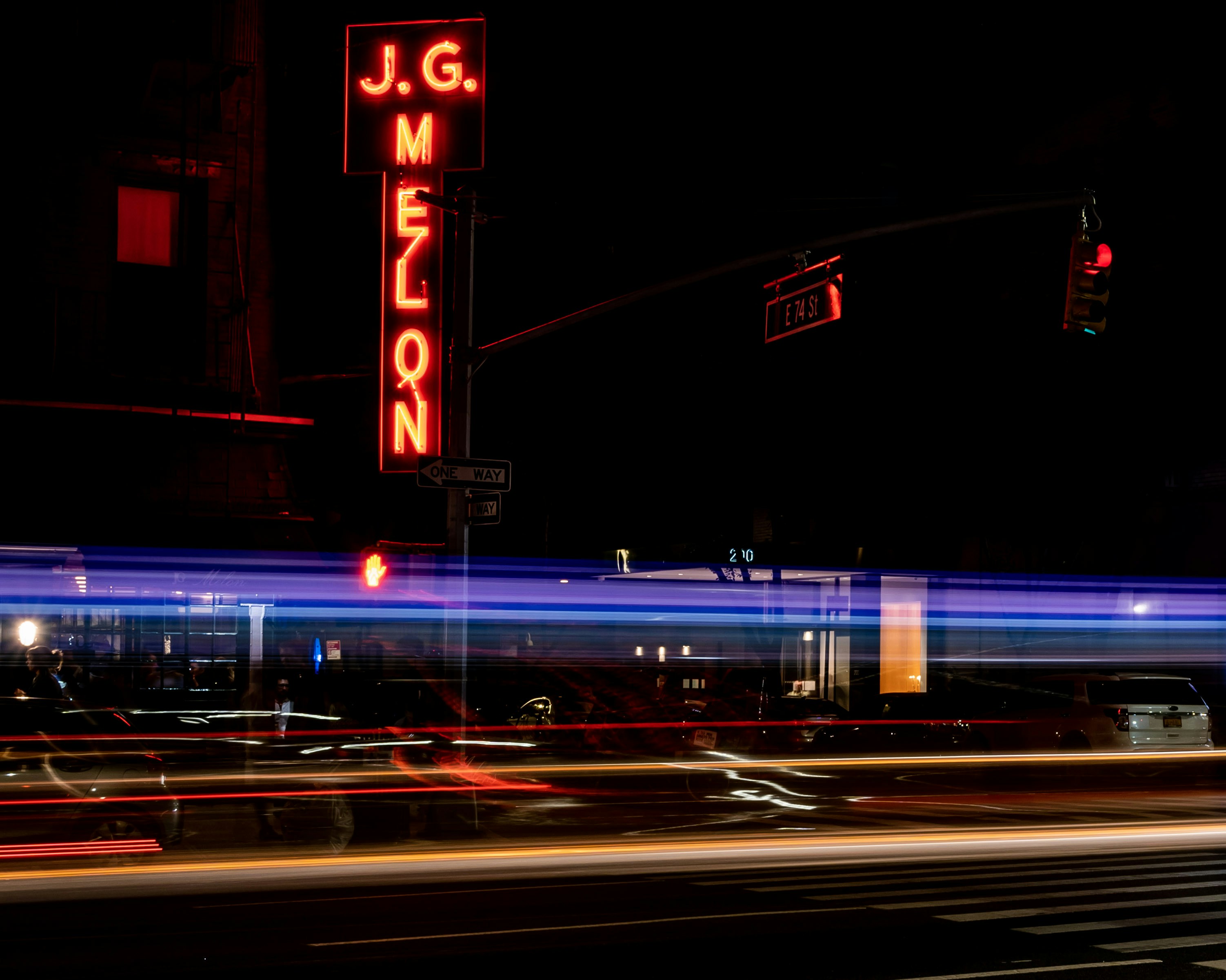 J.G. MEZON Neon Pulse Over a Streak-Filled Midnight Street