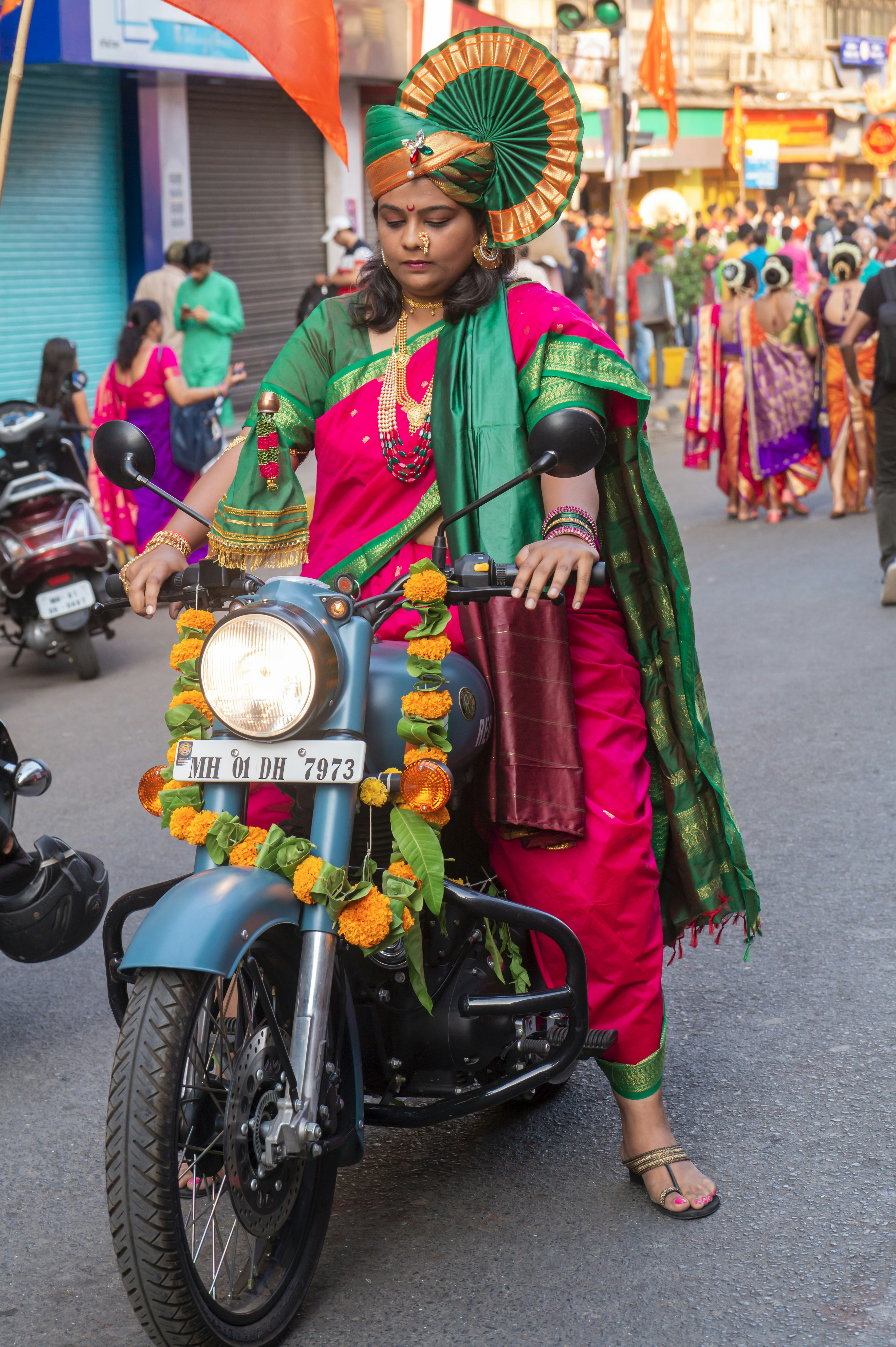 Woman in green long sleeve shirt riding blue motorcycle photo – Free ...