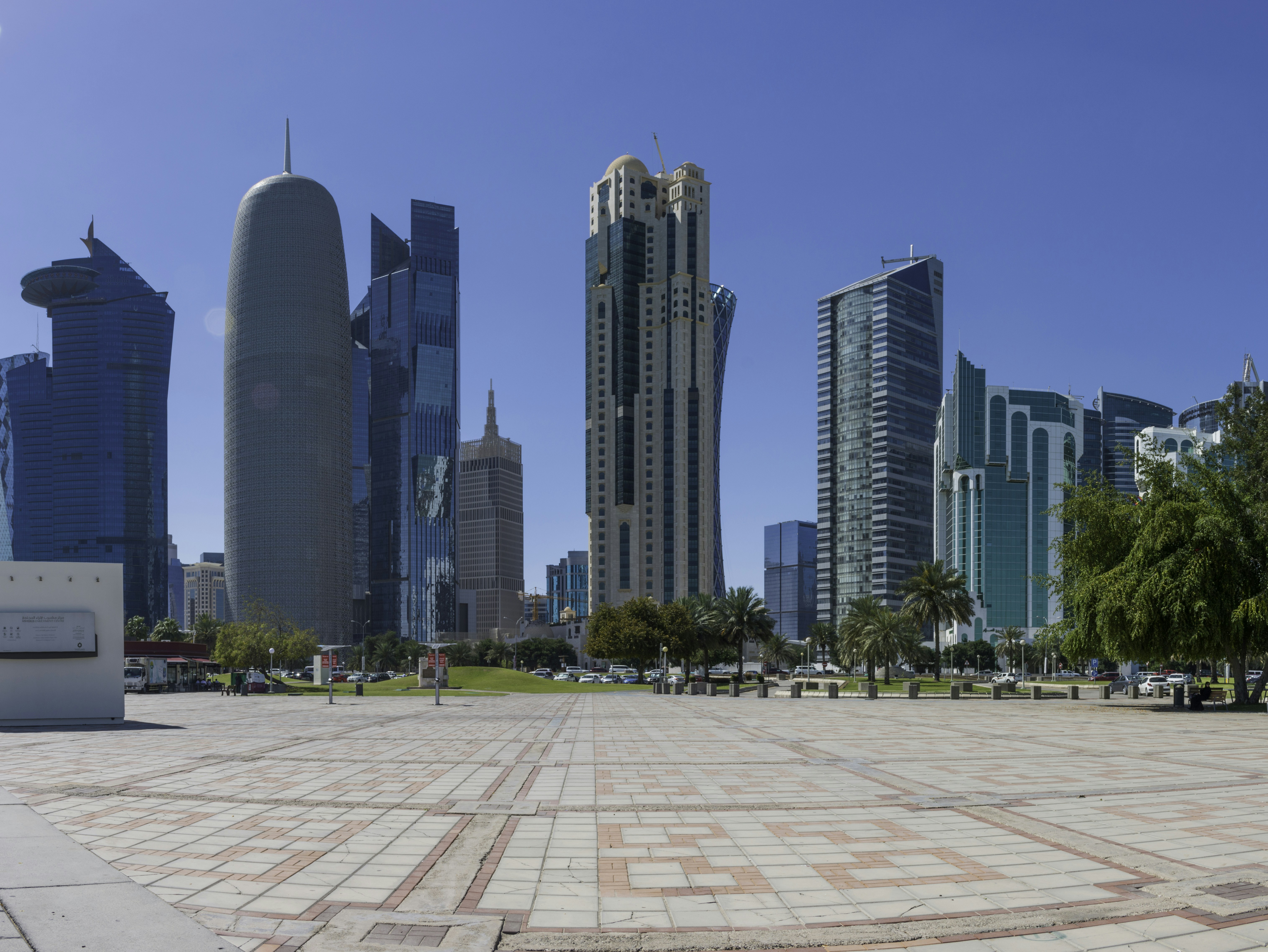 People walking on park near high rise buildings during daytime photo ...