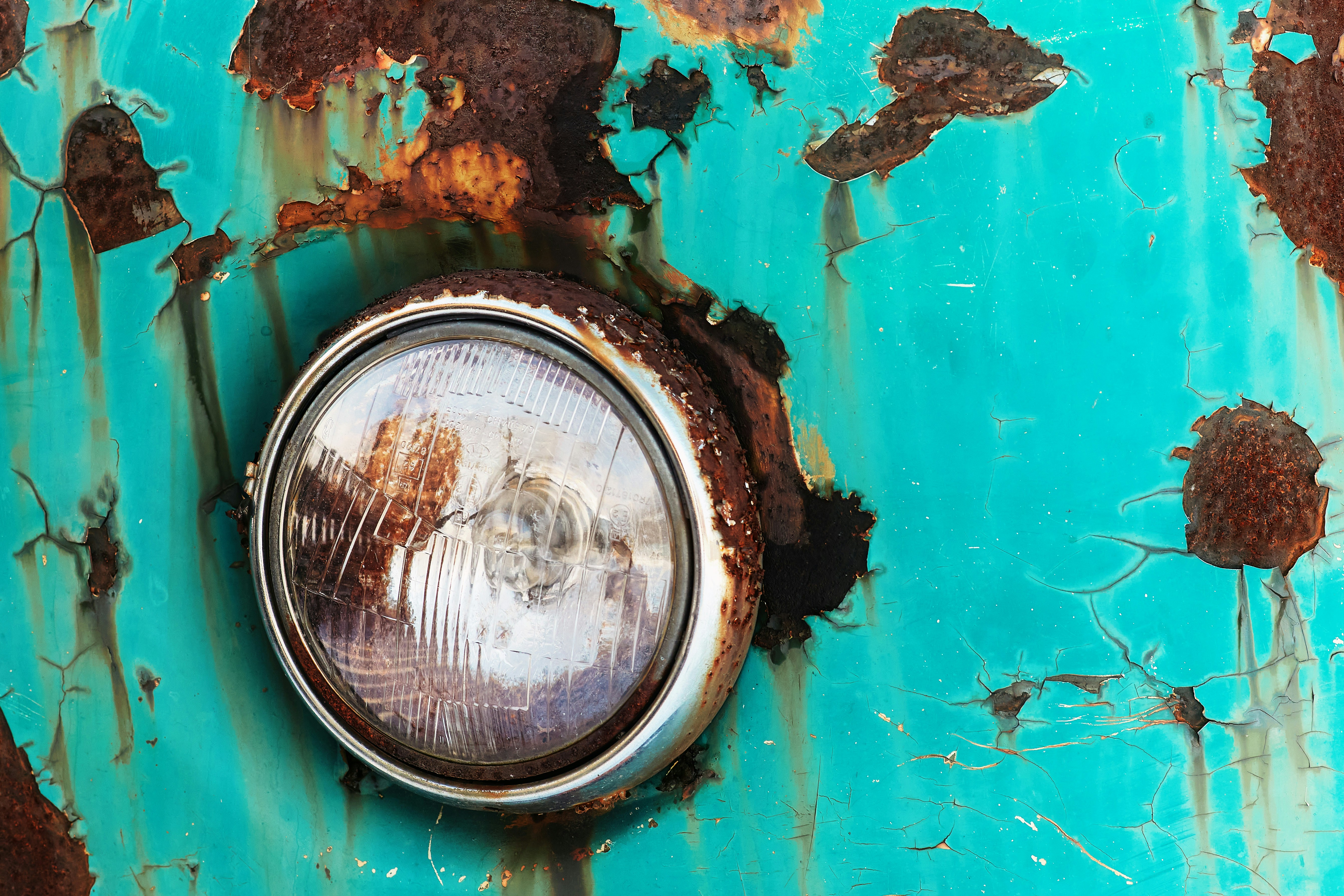 Turquoise Rust Cradle: The Weathered Headlight