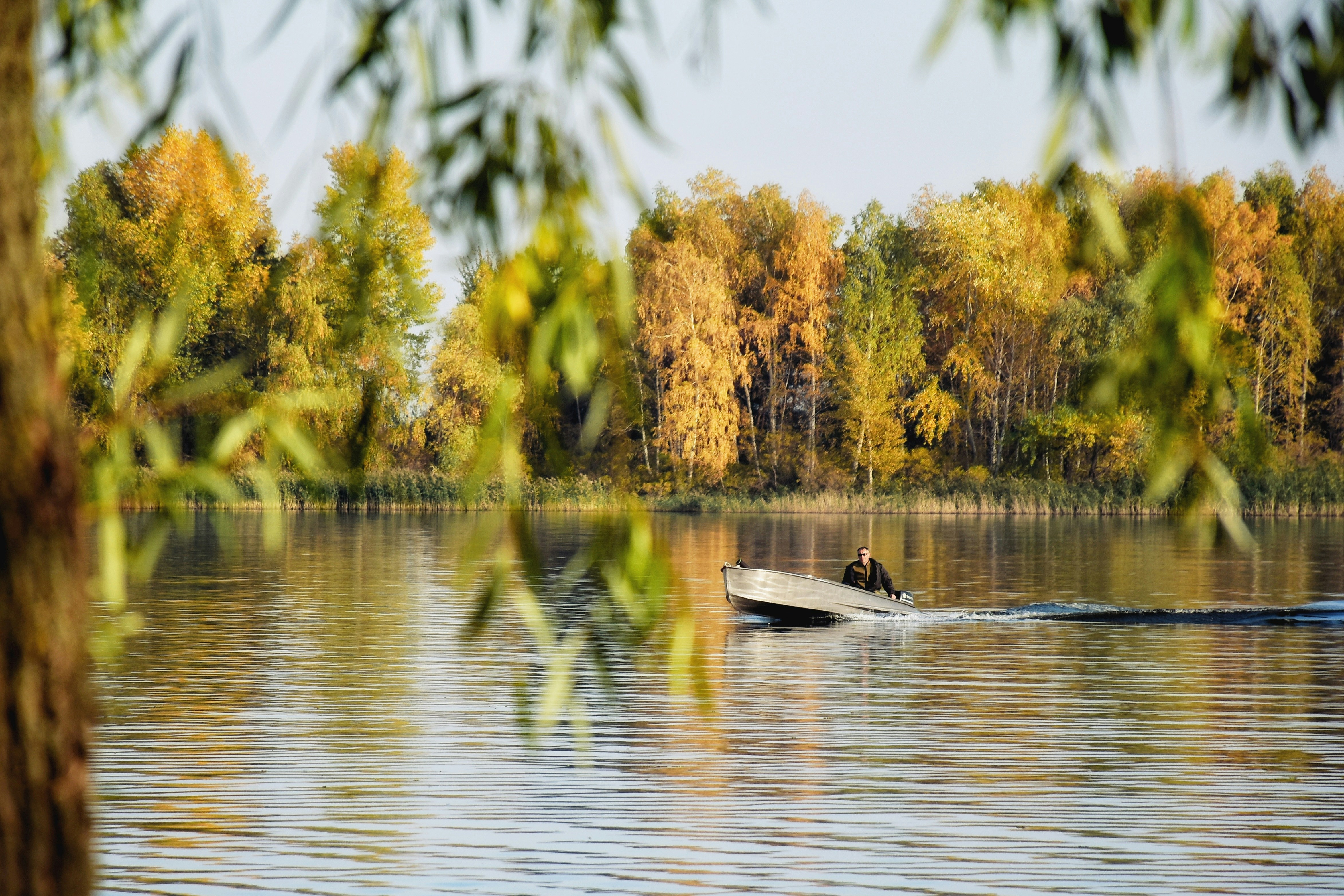 Man in black glasses on a boat
