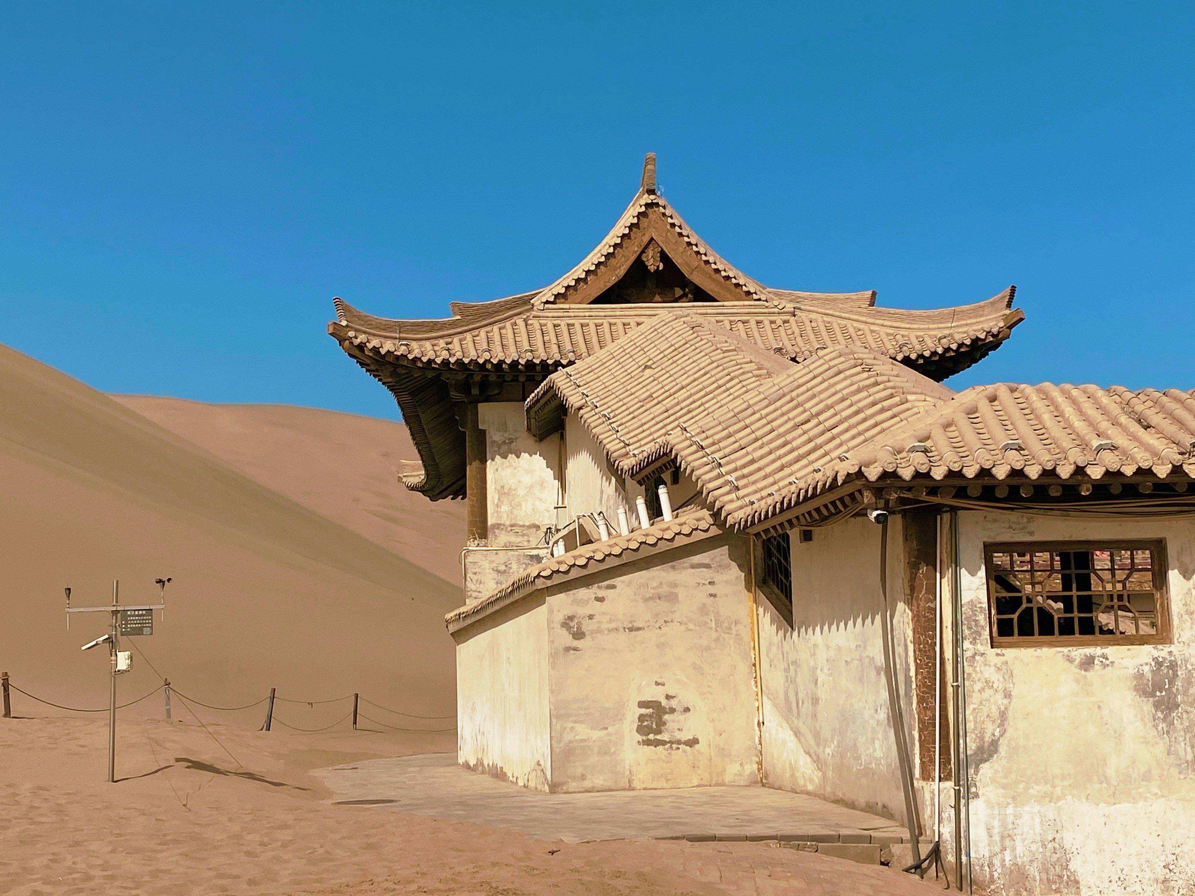 Desert Shrine: A Weathered Roof against Endless Dunes