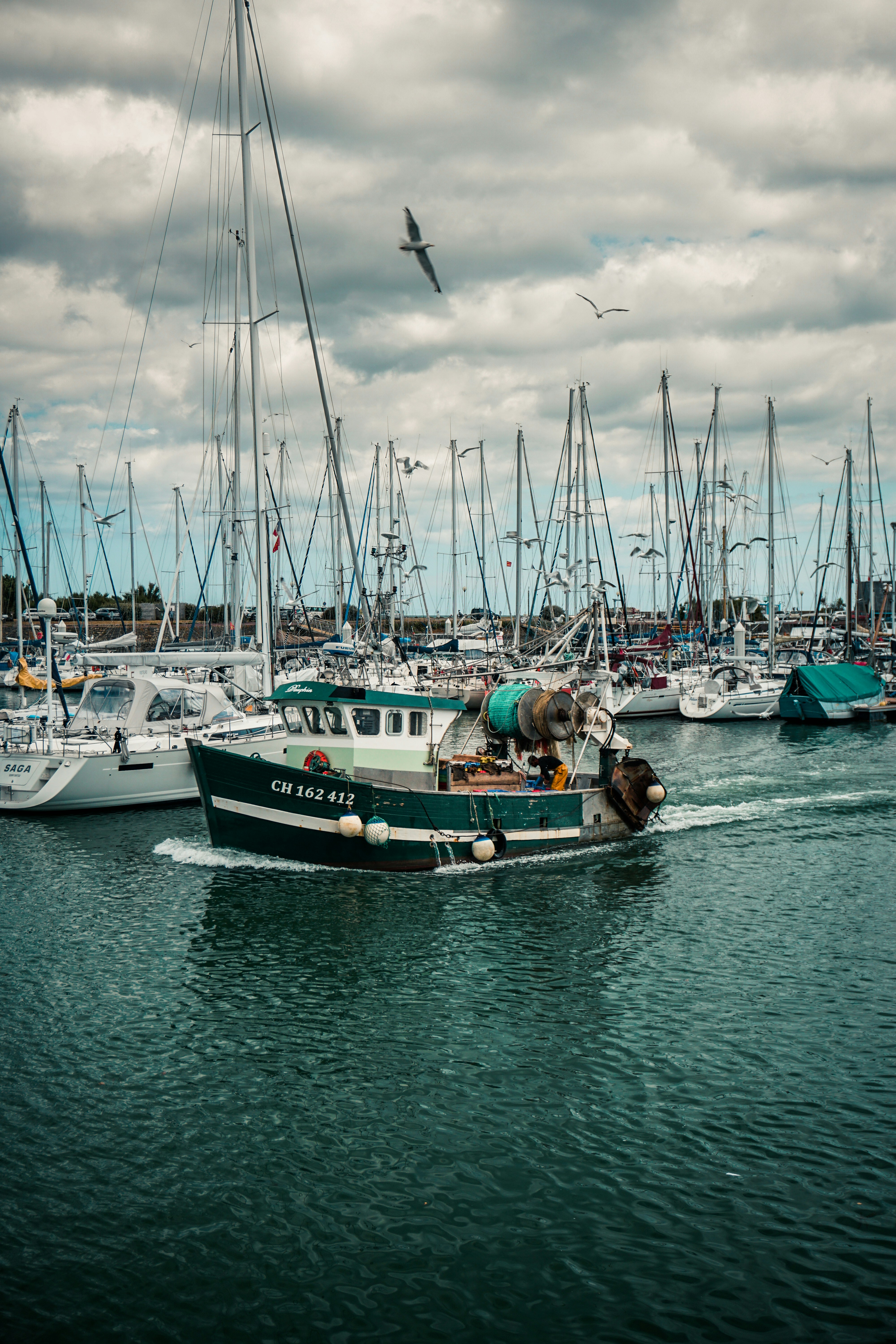 Harbor's Heartbeat: A Fishing Vessel in Motion
