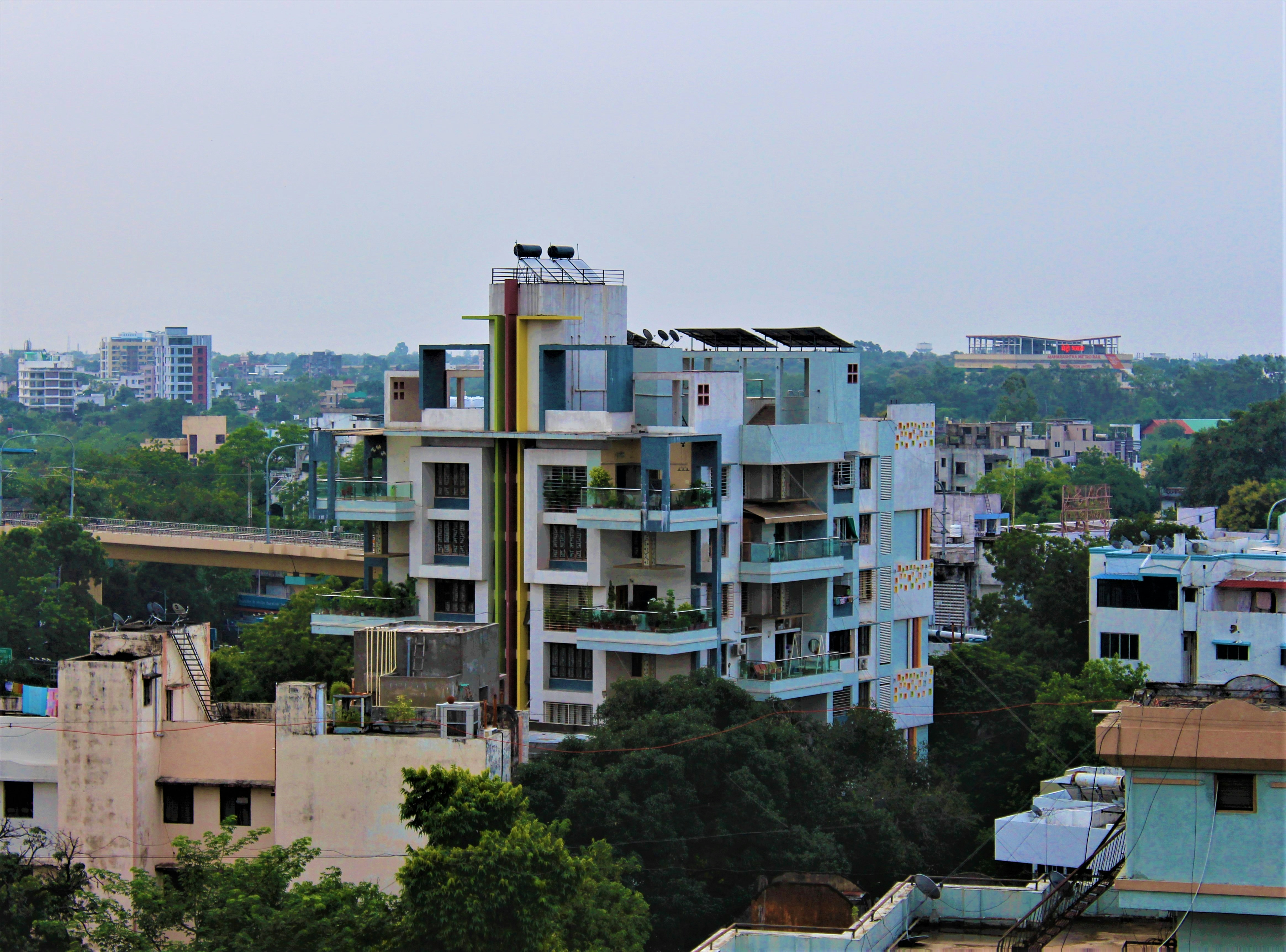 Vertical Stripe Tower Anchors a Verdant Cityscape