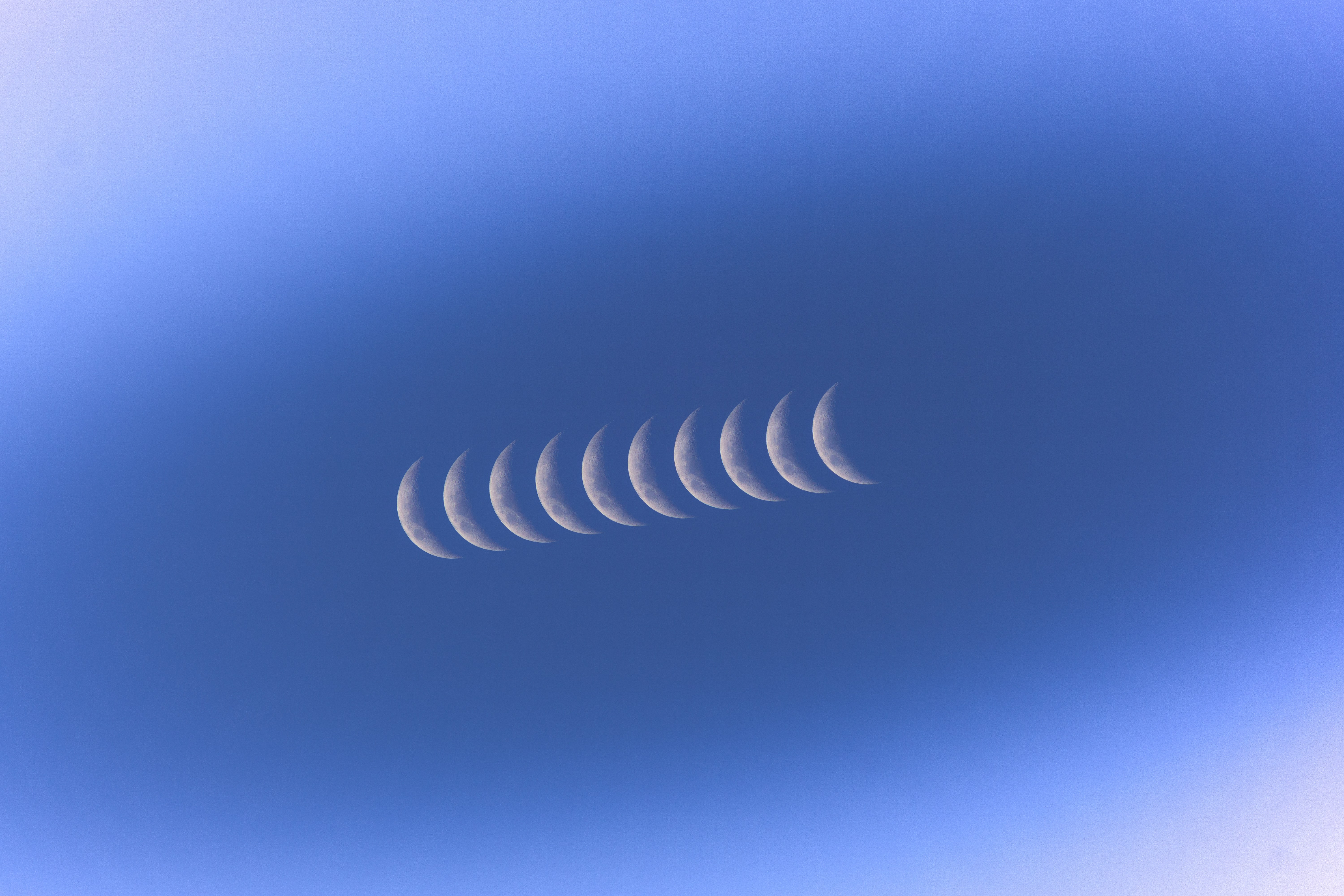 A blue sky with a few white circles in the middle of it photo – Free ...