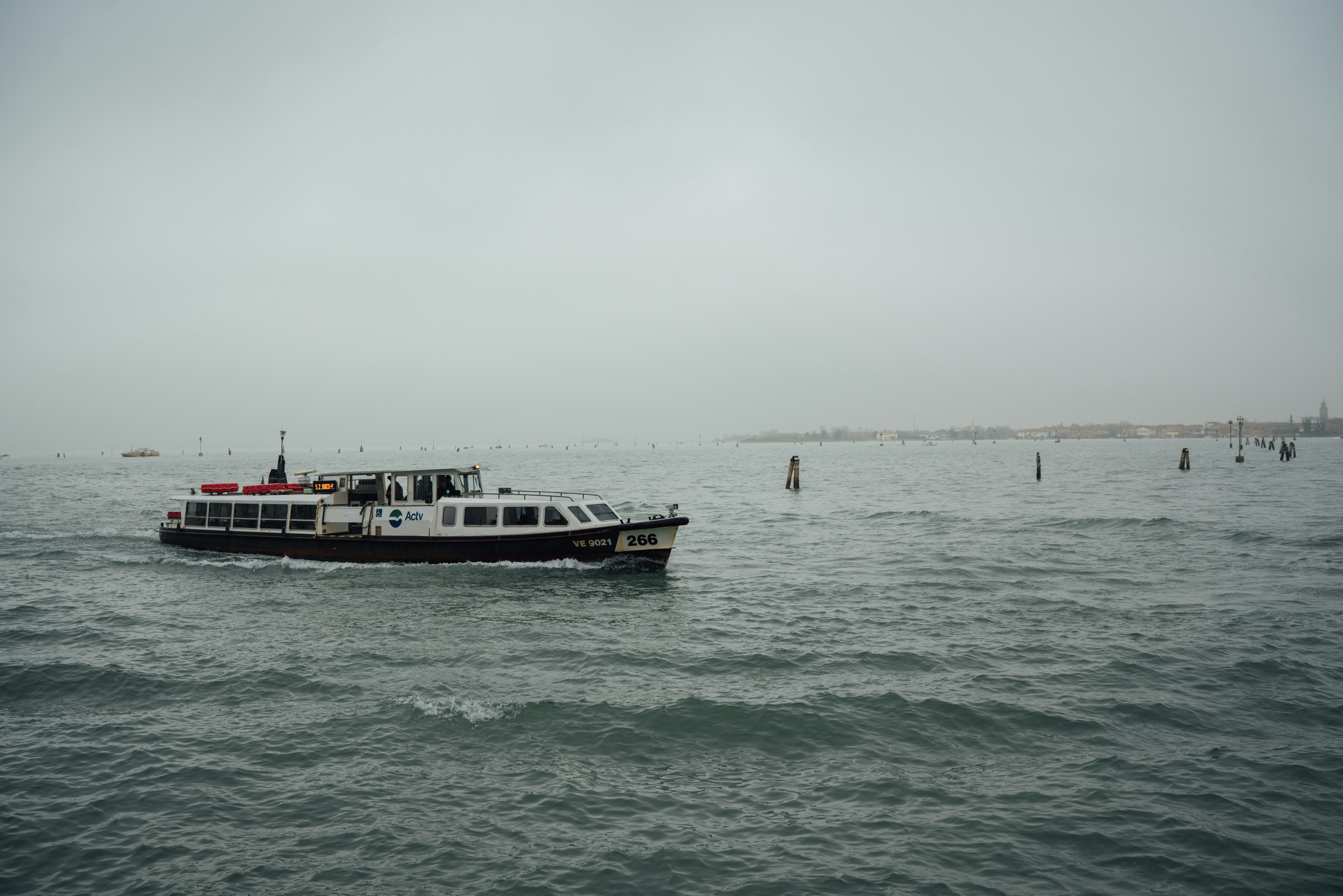 Haze Over the Harbor: The Ferry’s Quiet Morning Wake