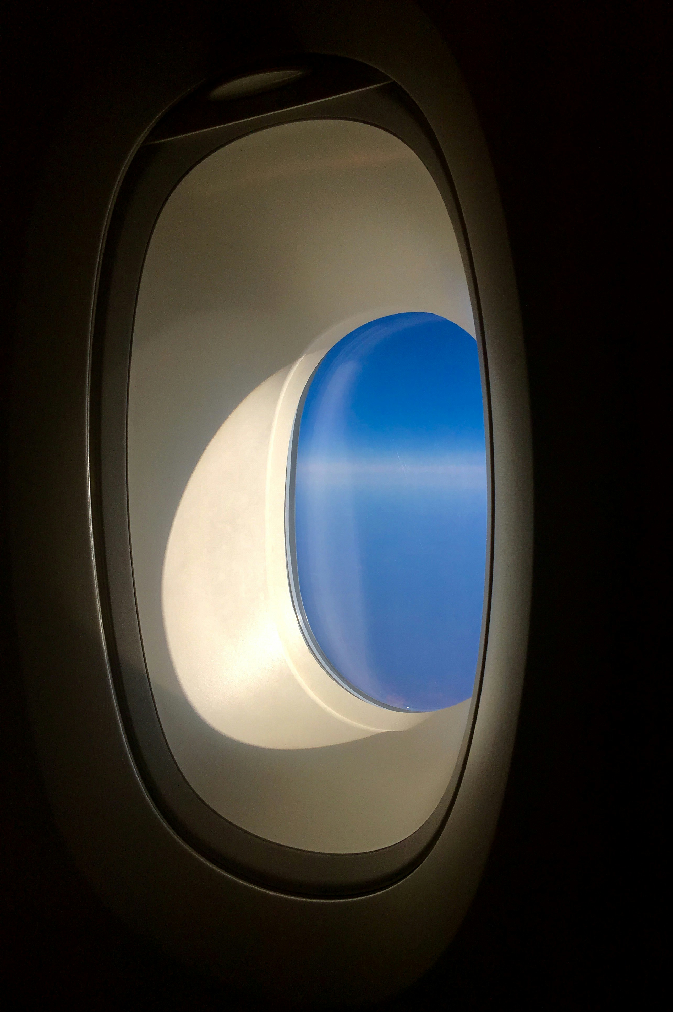 white and blue round frame