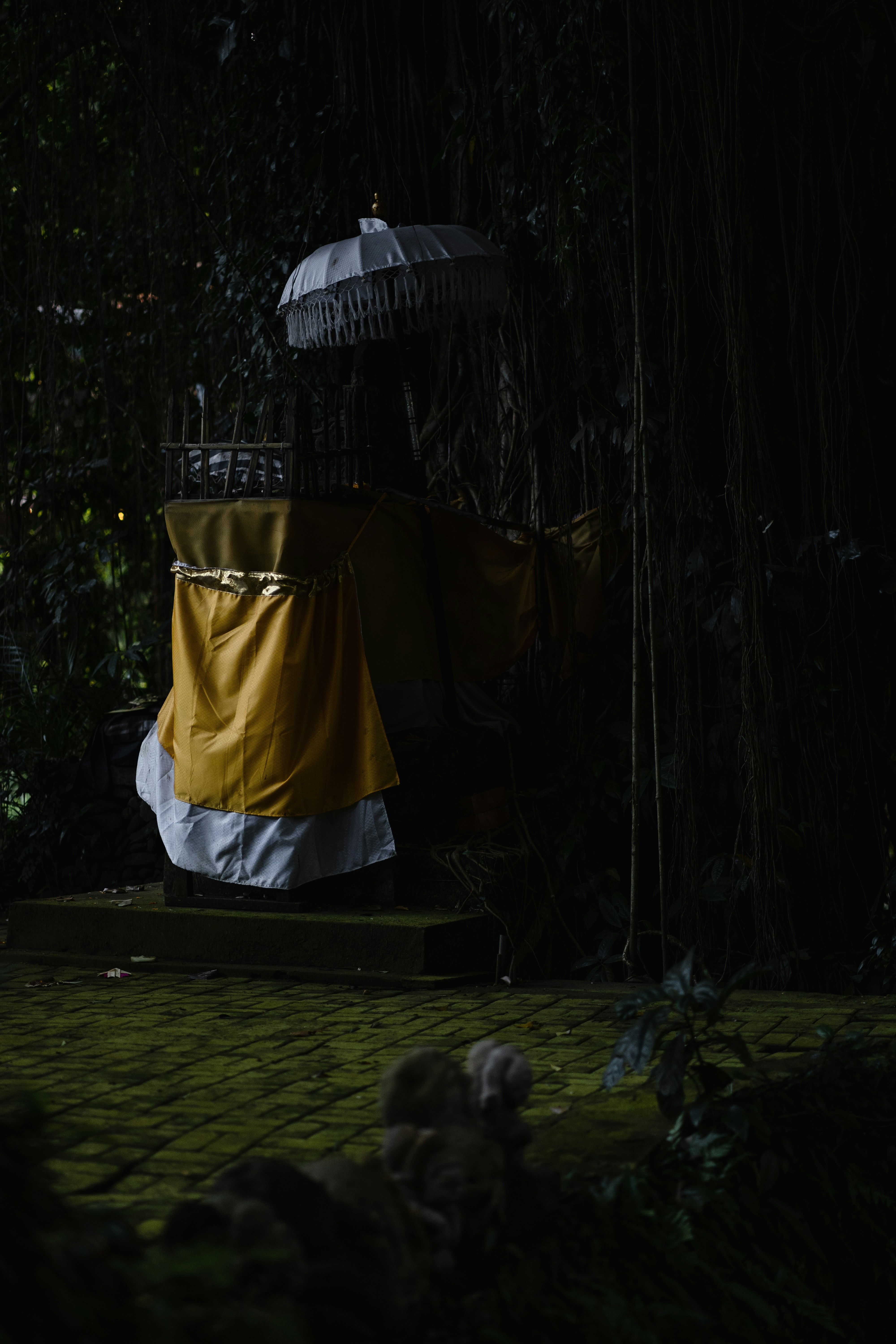 Whispering Shrine Under Rain: A Lanterned Altar Veiled in Night
